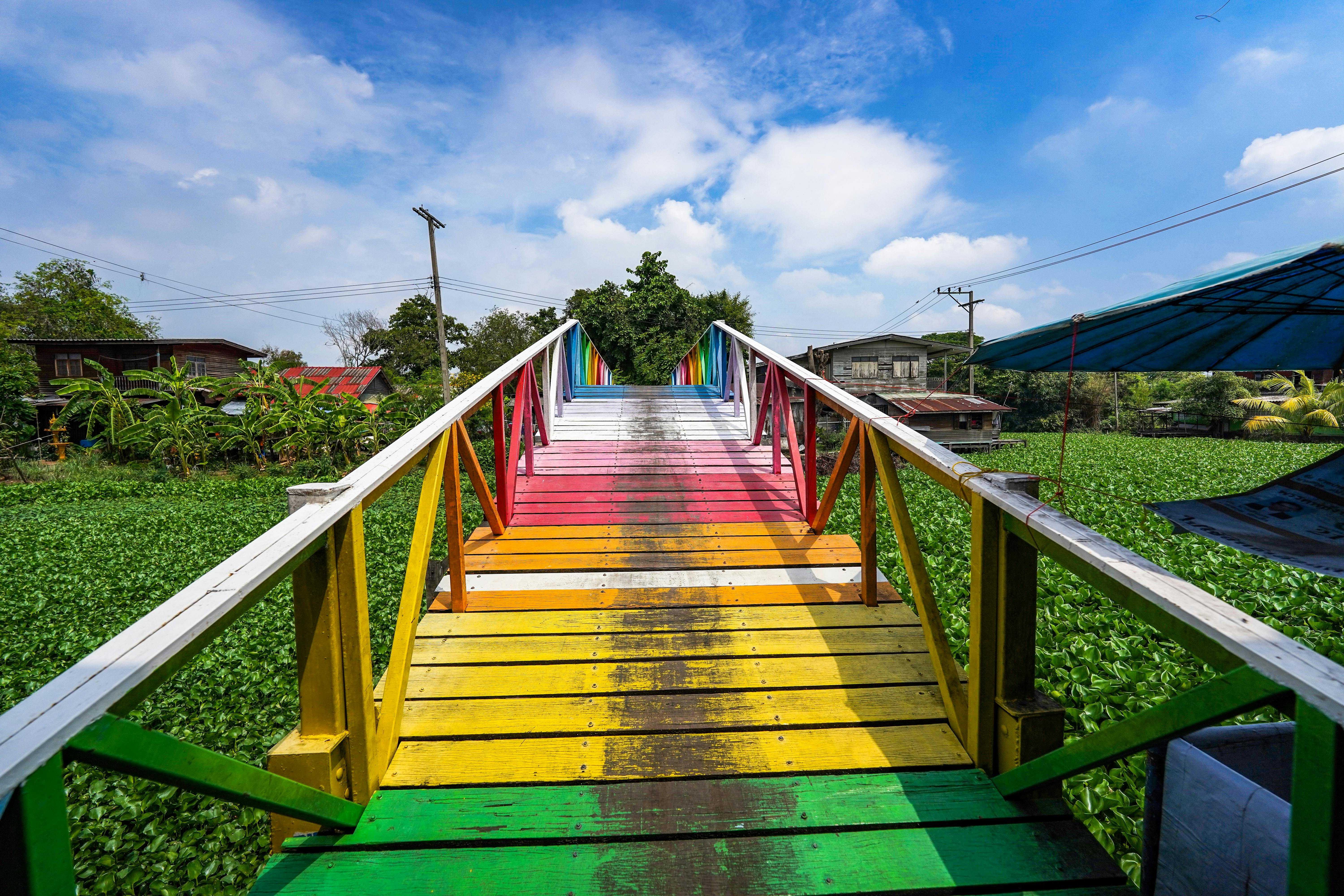 Colorful Wooden Footbridge on a River · Free Stock Photo