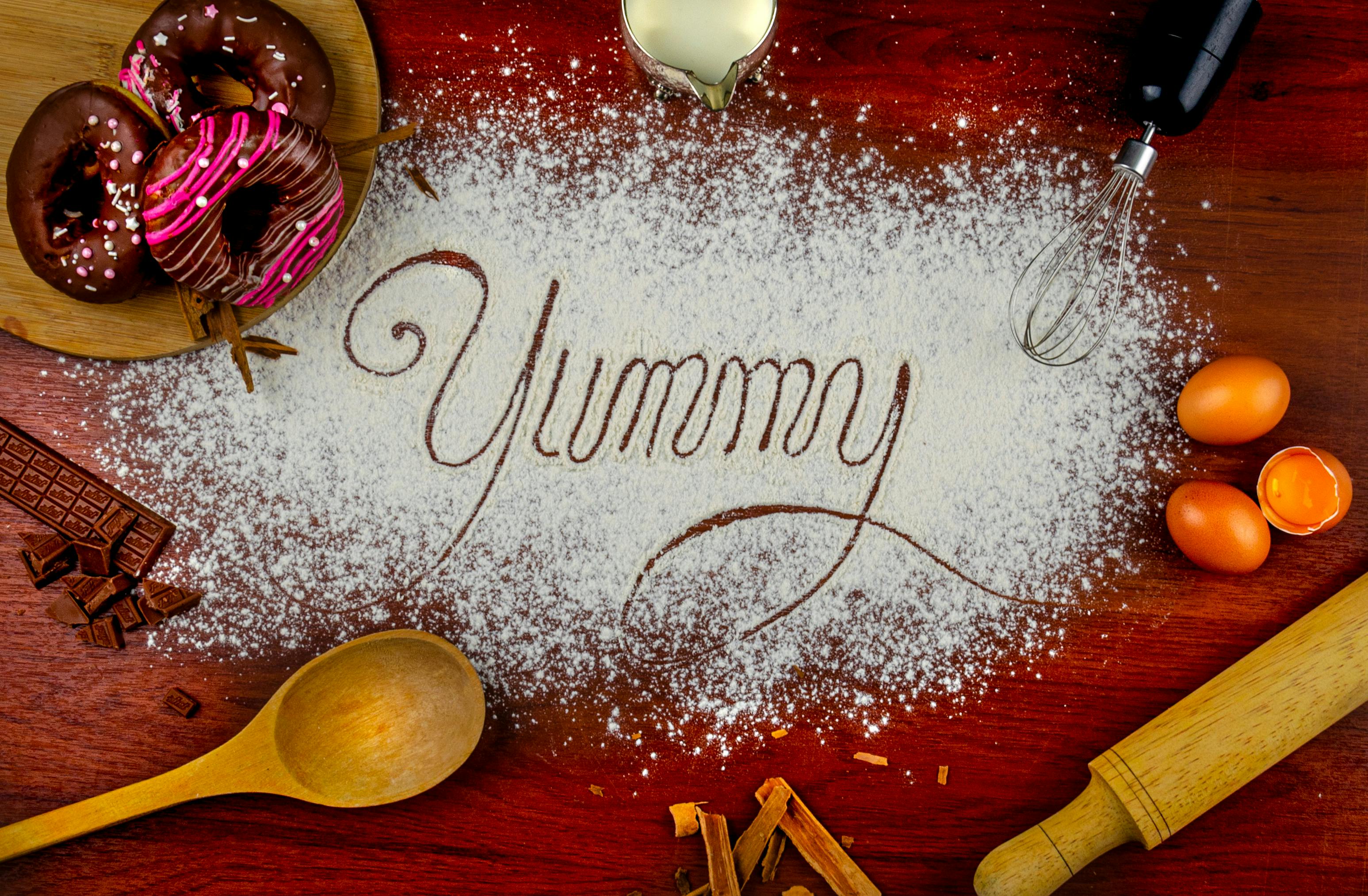 Yummy Word Written on Flour · Free Stock Photo