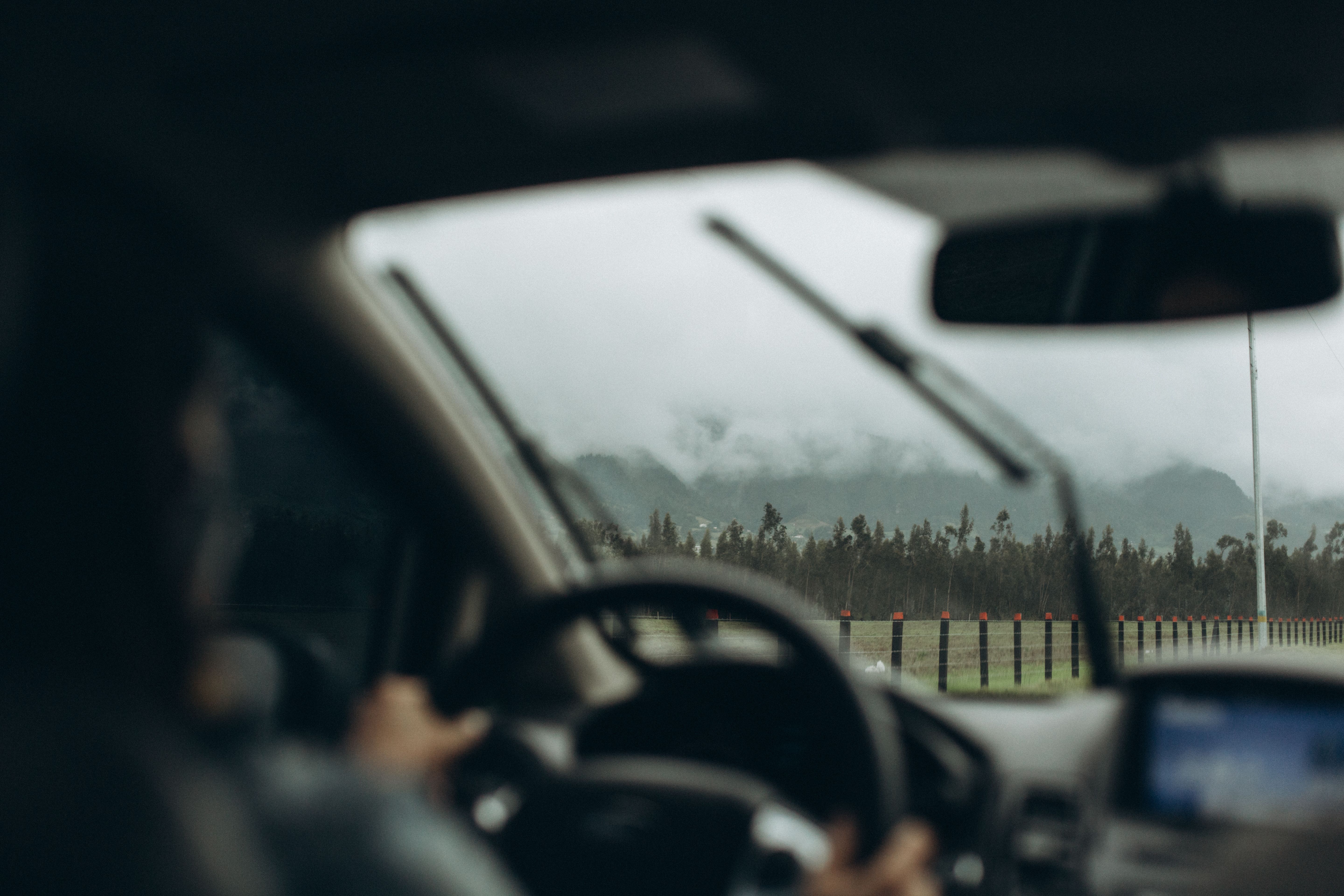 Driver inside a Car on a Drive Thru · Free Stock Photo