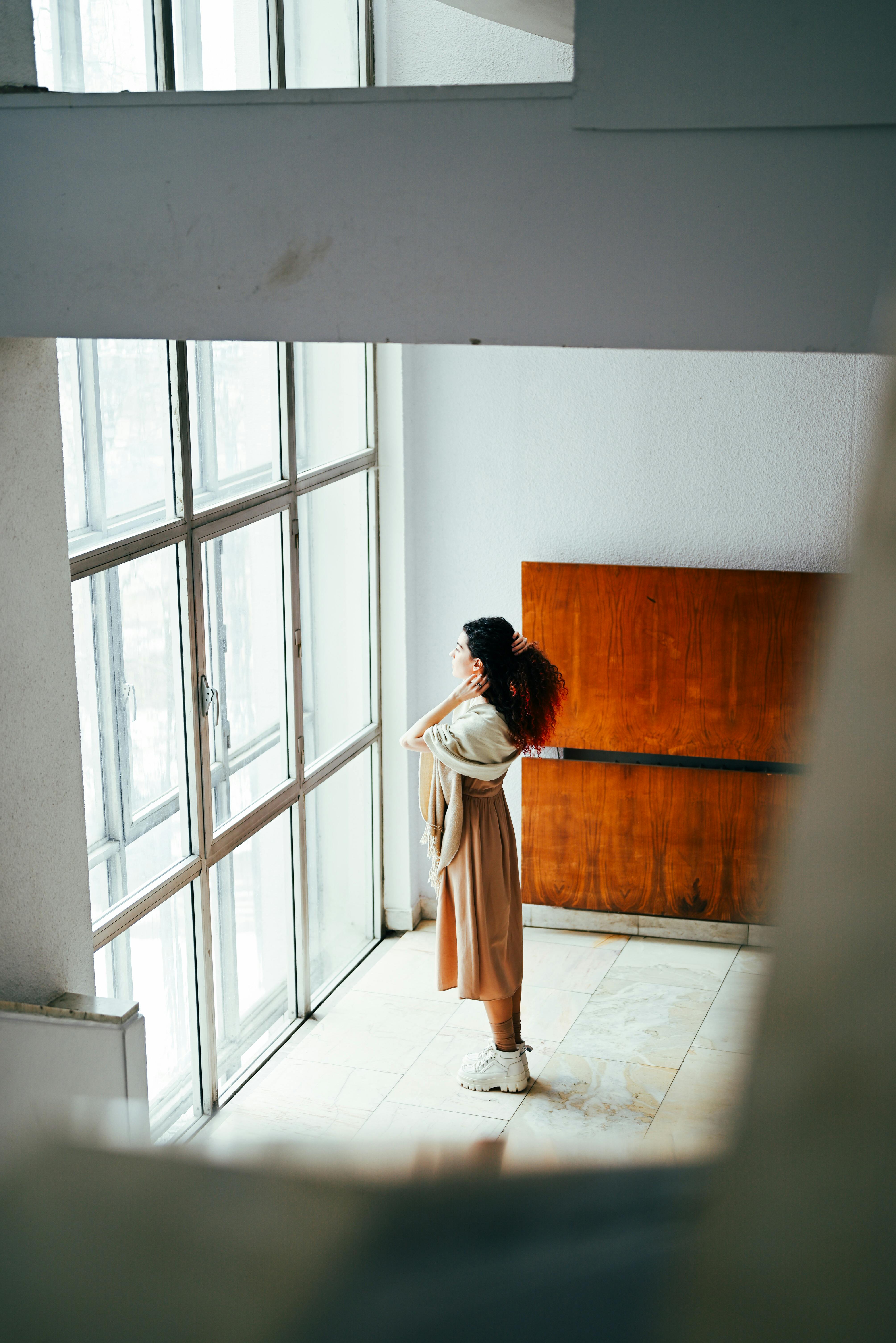 Person Looking Outside the Window · Free Stock Photo