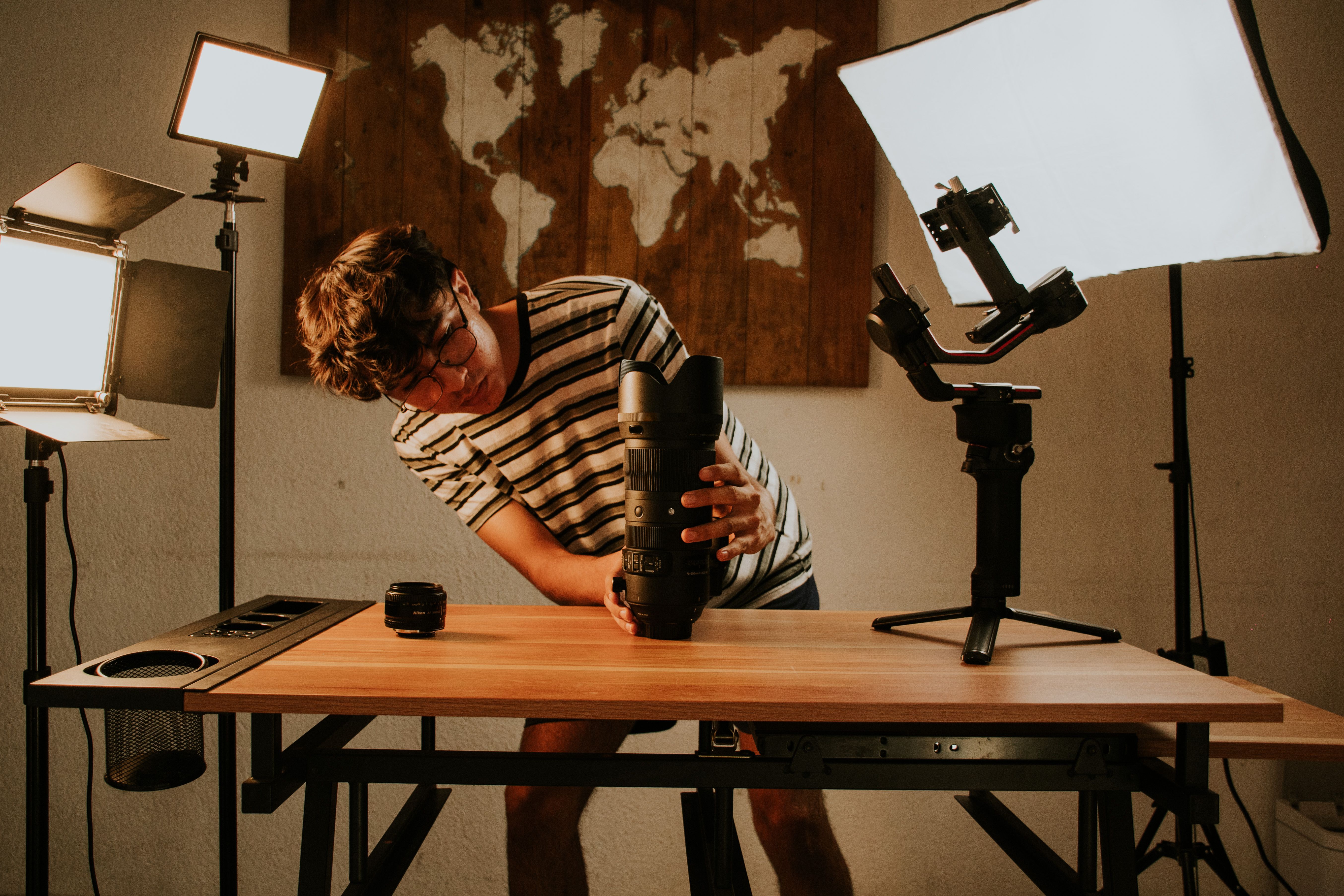 Man Preparing His Camera Lens · Free Stock Photo