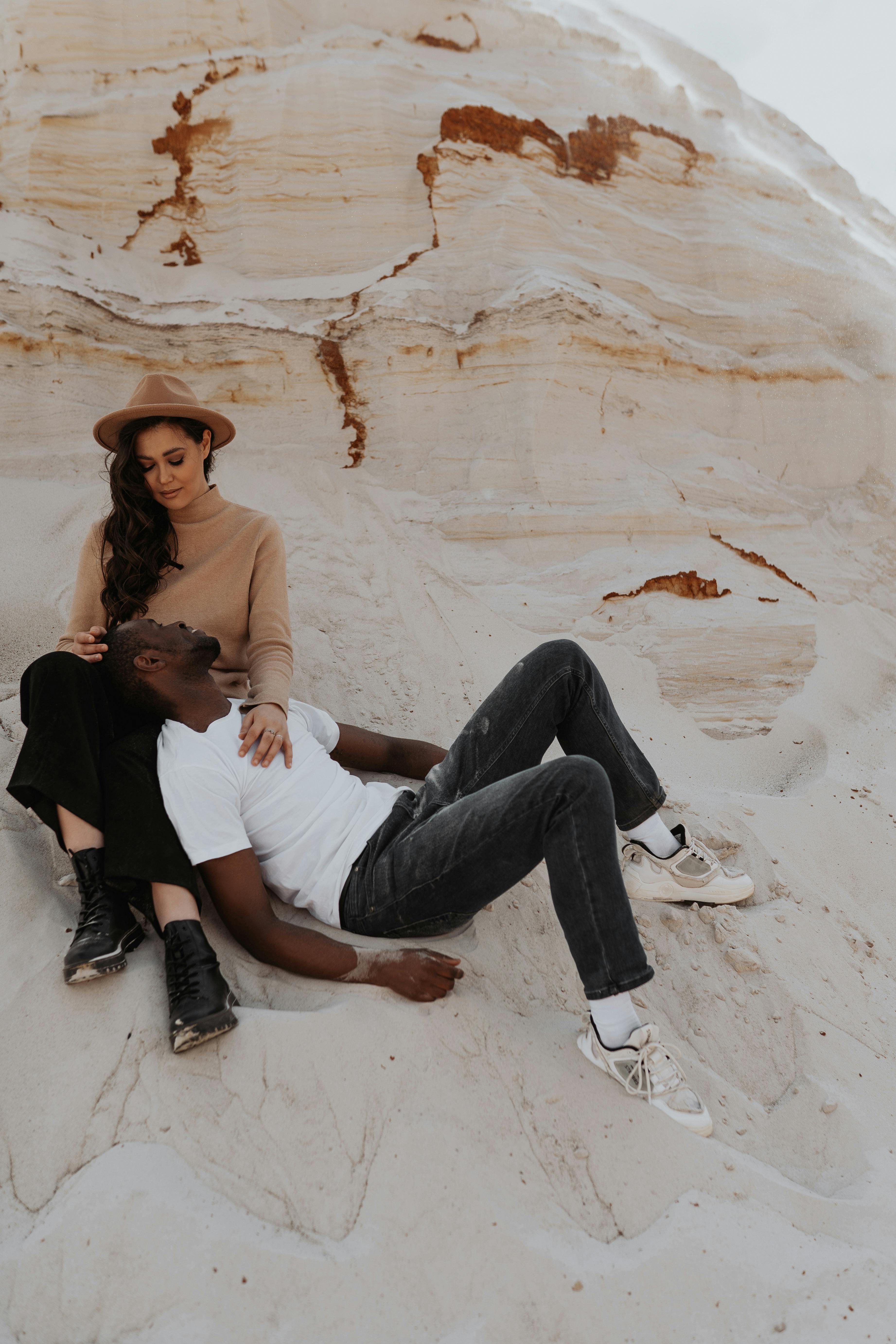 Man Lying on Woman's Lap · Free Stock Photo