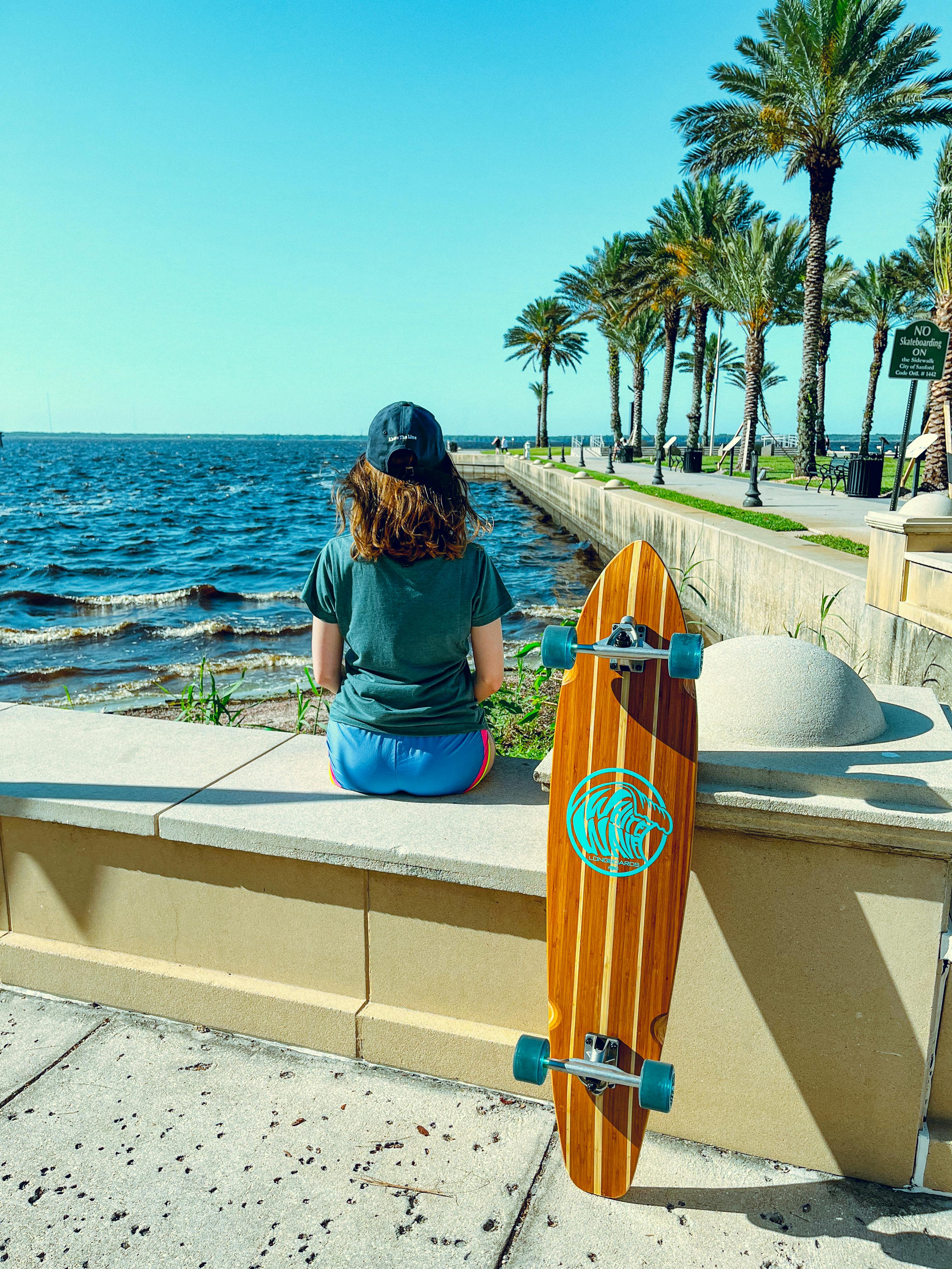 Person Looking Over the Concrete Railing · Free Stock Photo