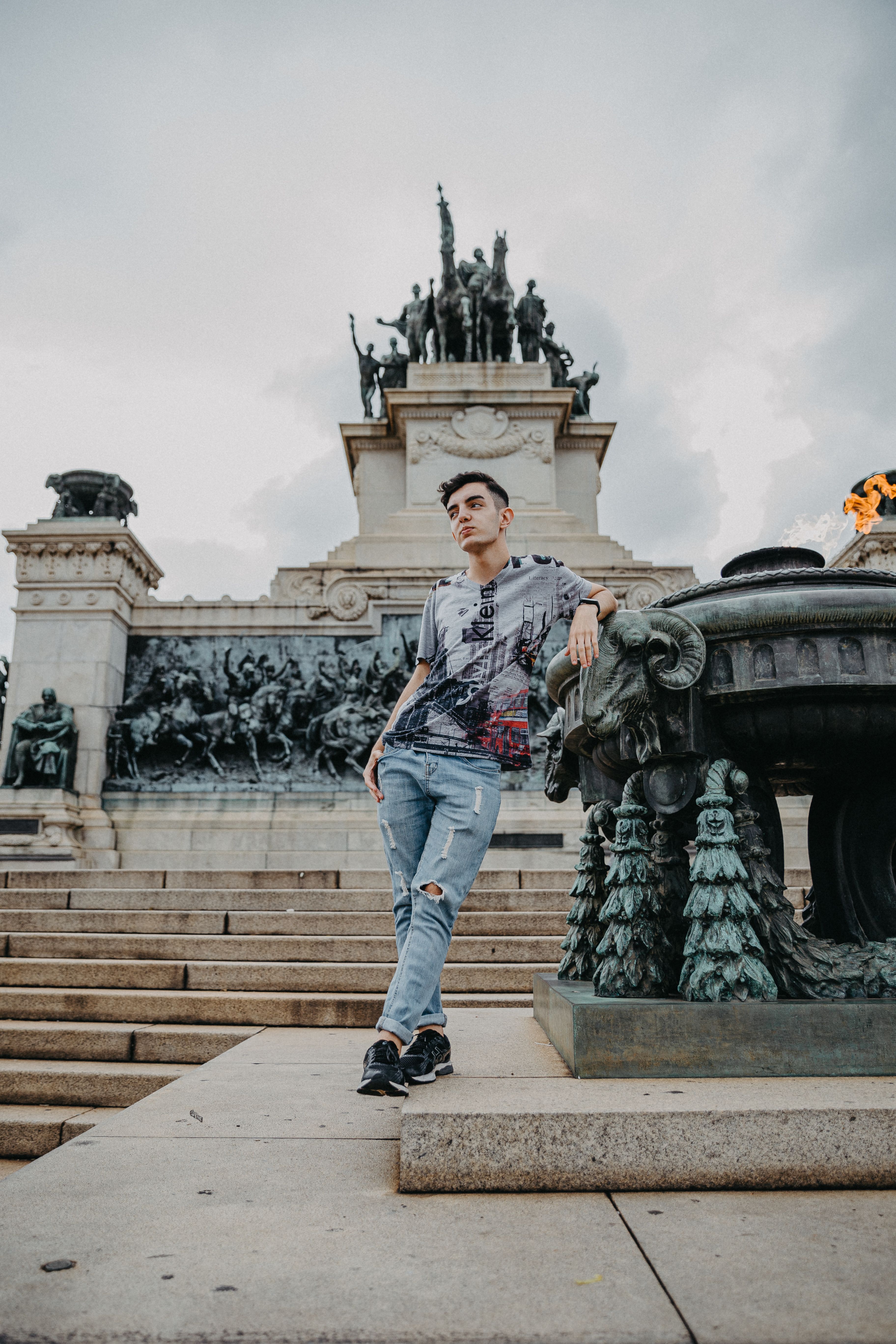 Man Posing near Statues · Free Stock Photo