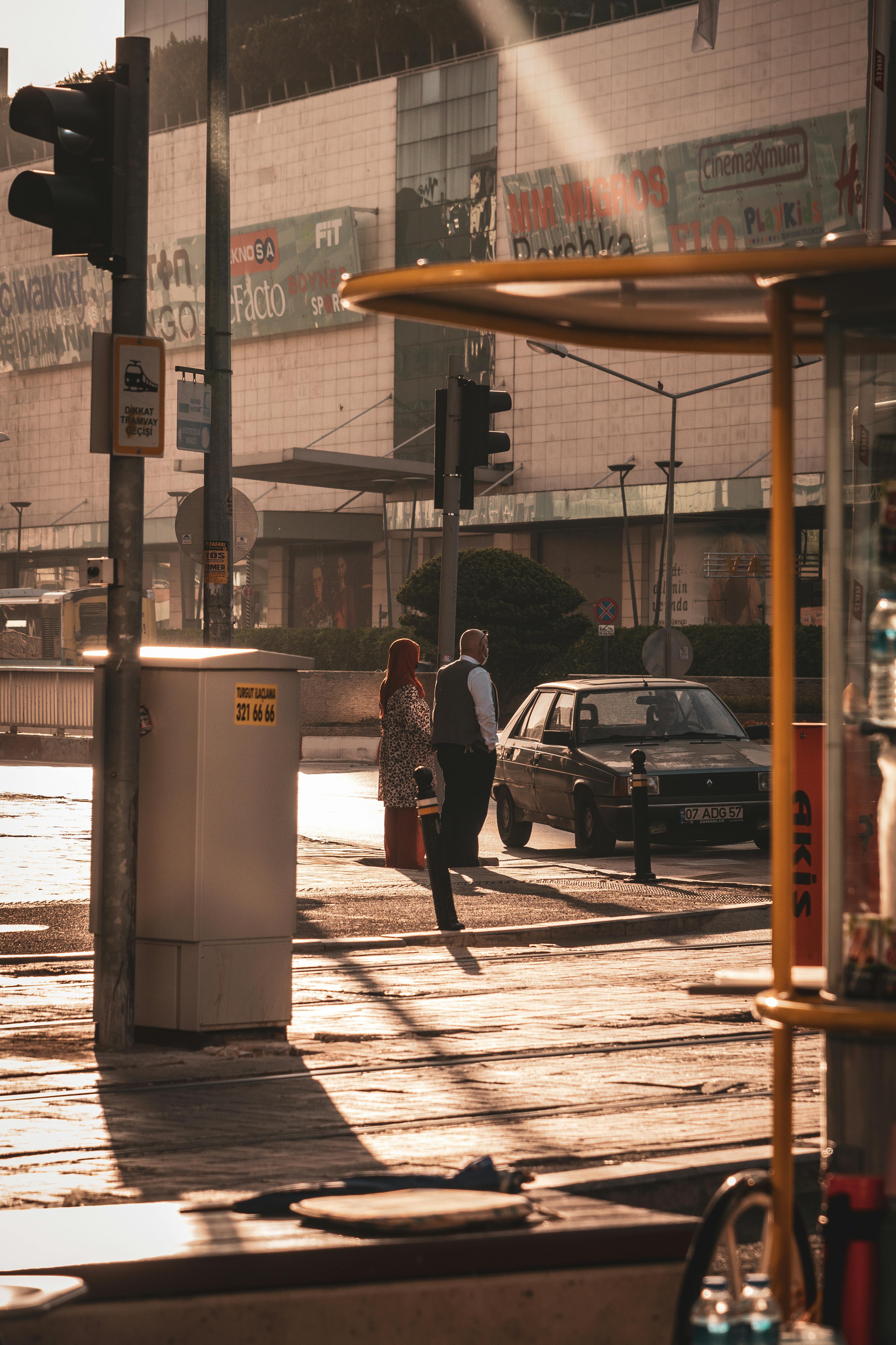 Couple Standing next to a Traffic Light · Free Stock Photo