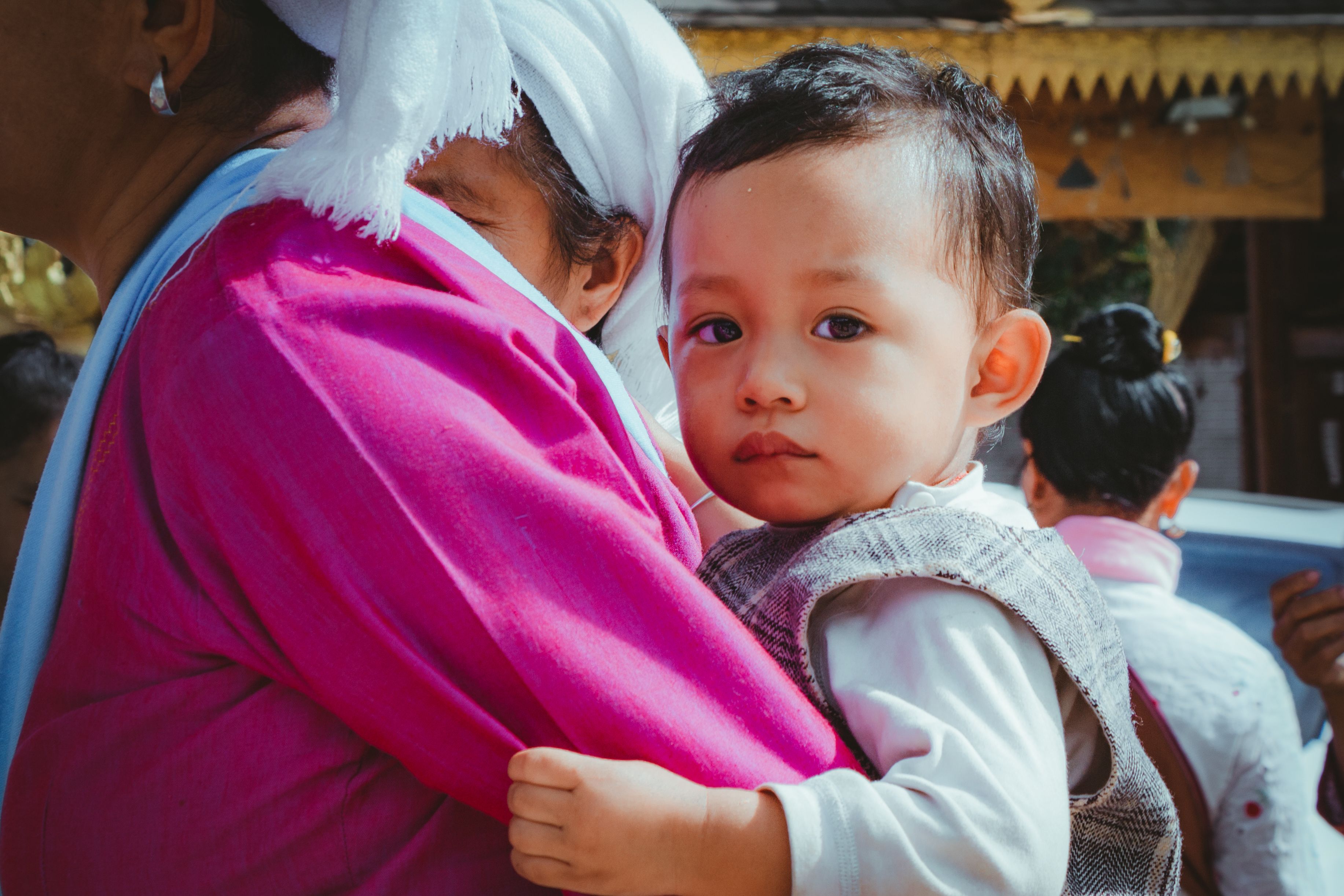 Boy and Girl Standing Near Blue Wall · Free Stock Photo