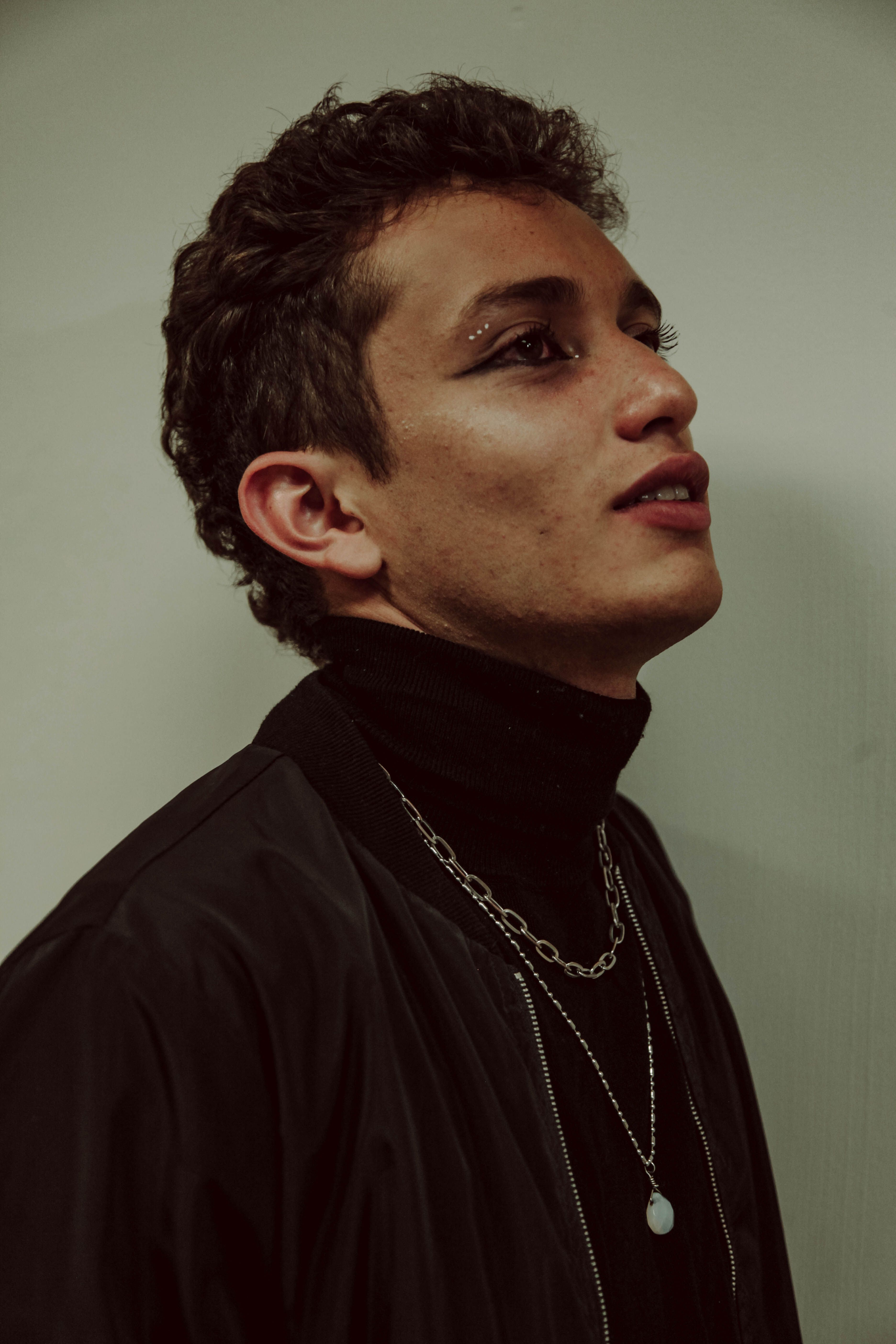 Man in Black Turtleneck Wearing Silver Necklaces · Free Stock Photo