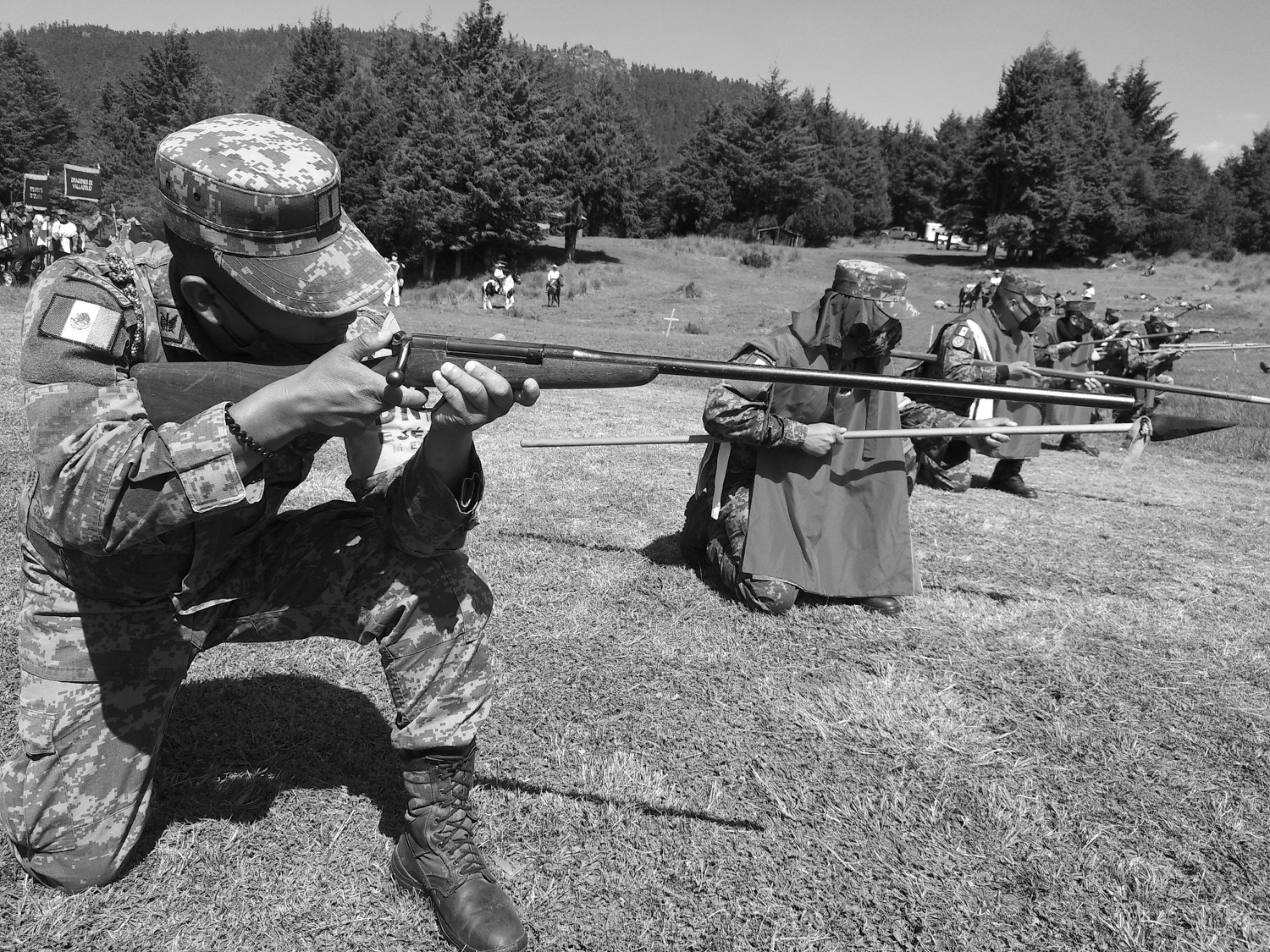 Photo of Kneeling Soldiers in a Line with Gun Ready for Shooting · Free ...