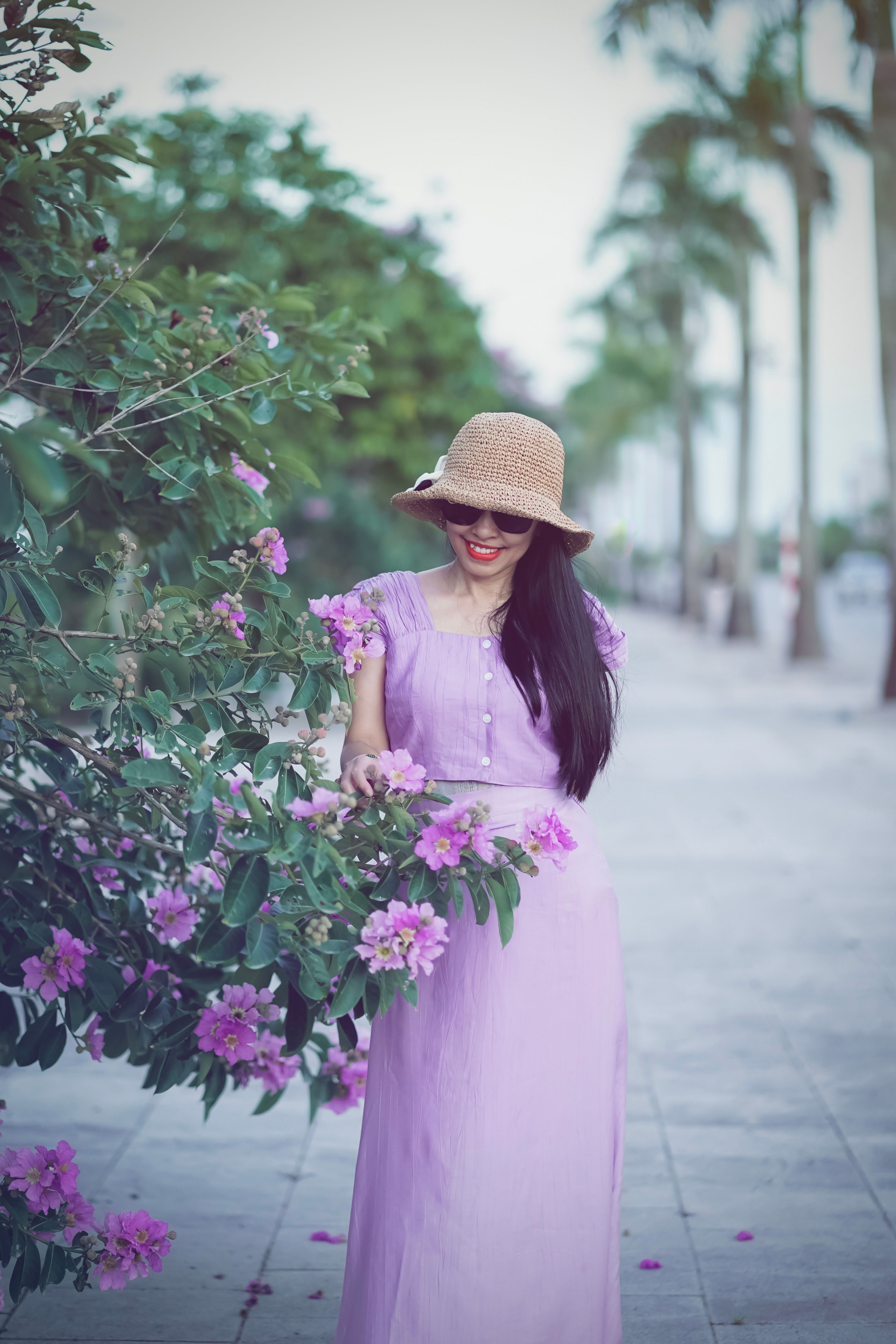 Woman in Purple Dress Holding the Purple Flowers on a Plant · Free ...