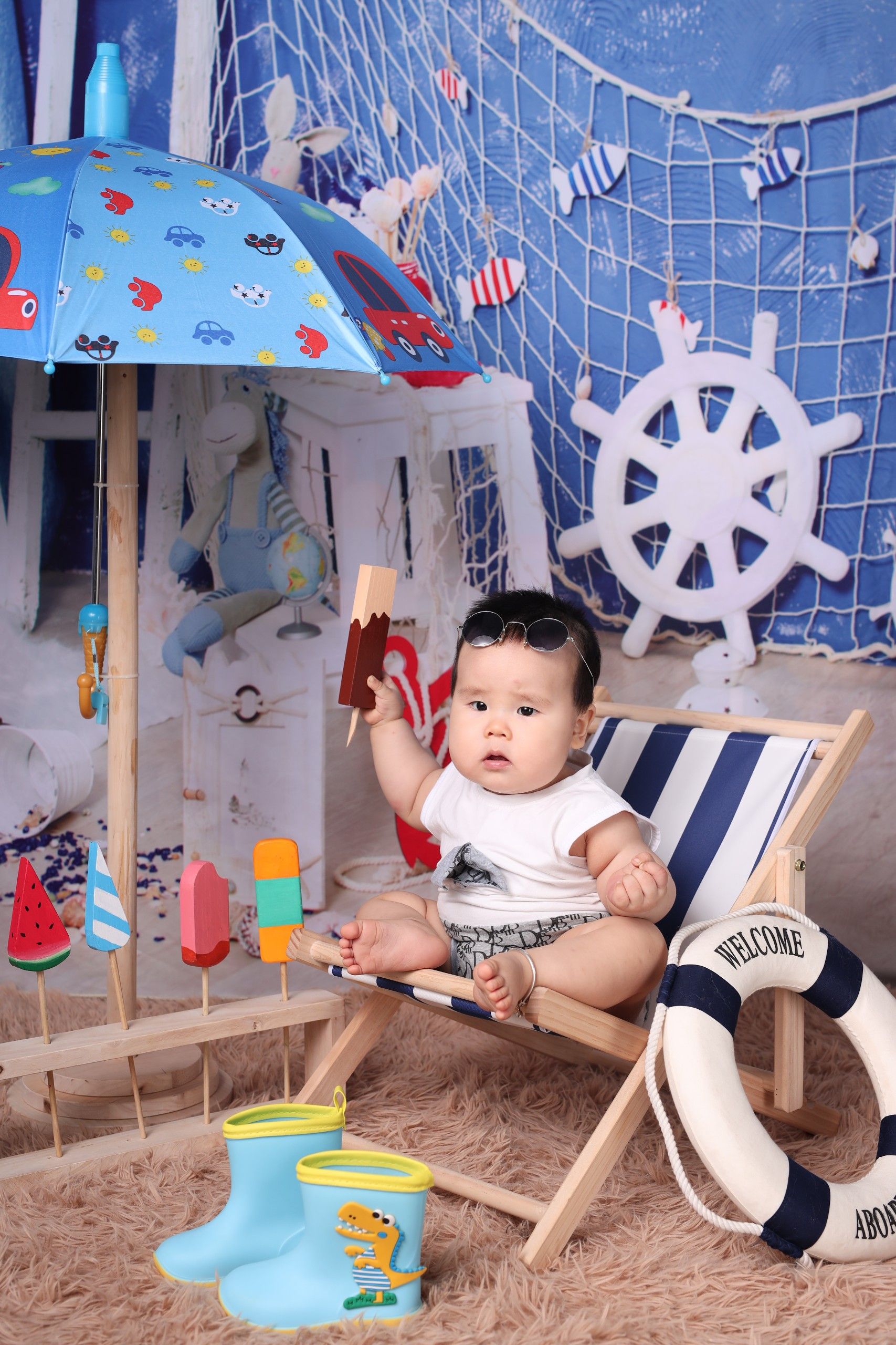Studio Shot of Baby on Deck Chair · Free Stock Photo
