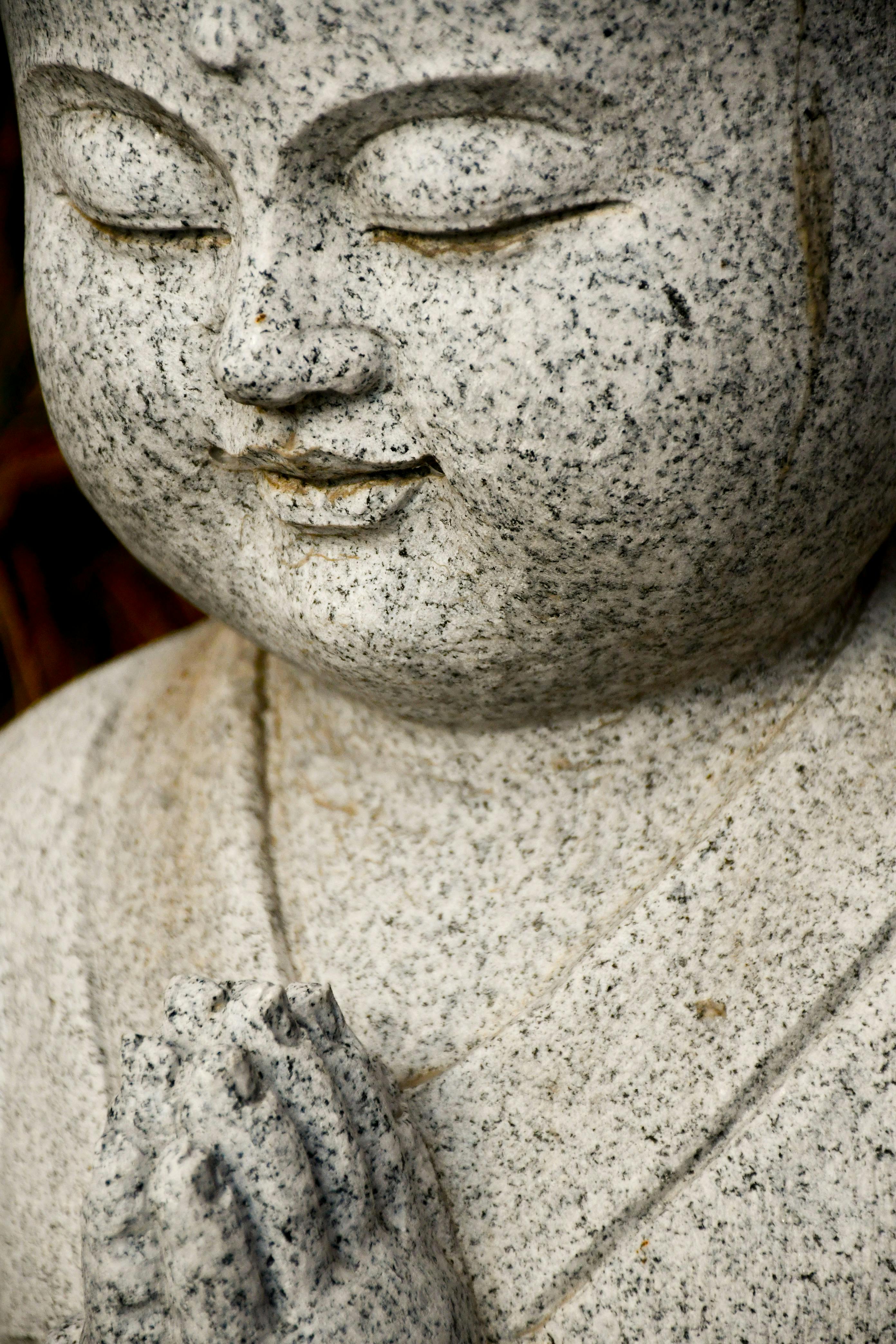 Gray Stone Statue of Buddha in Close Up Photography · Free Stock Photo