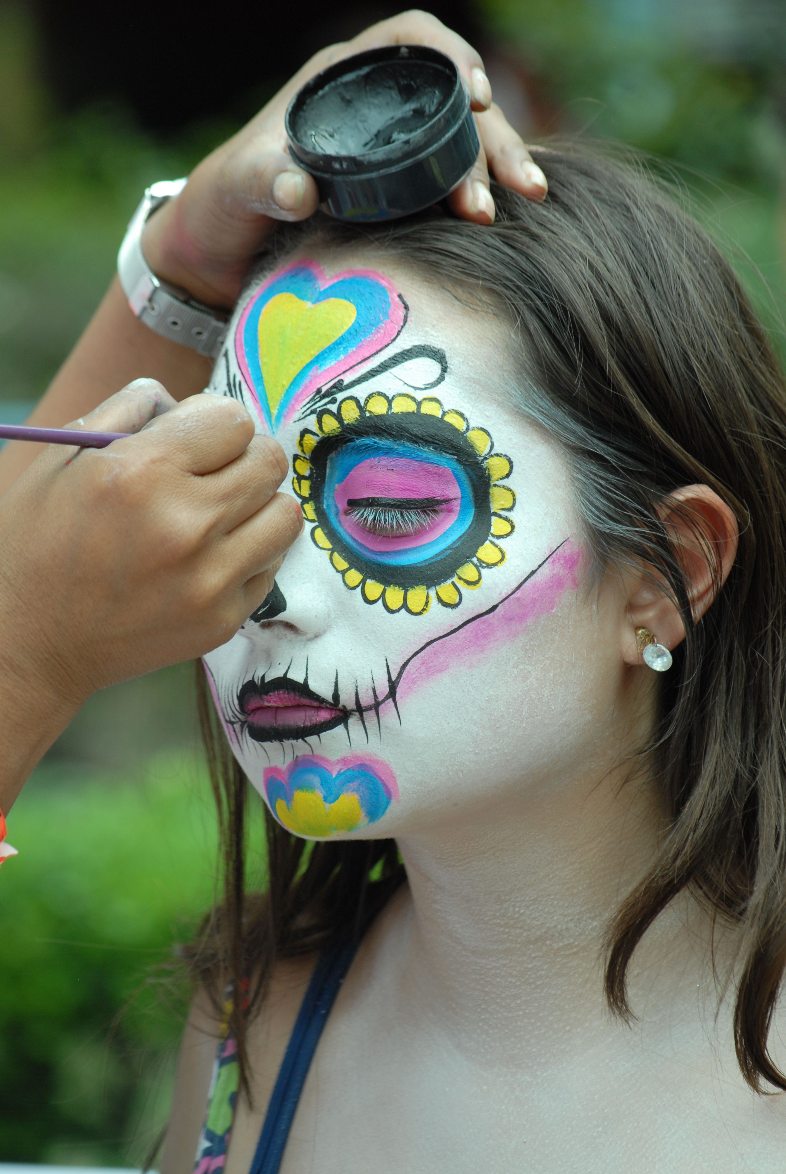 A Woman Having Her Face Painted · Free Stock Photo