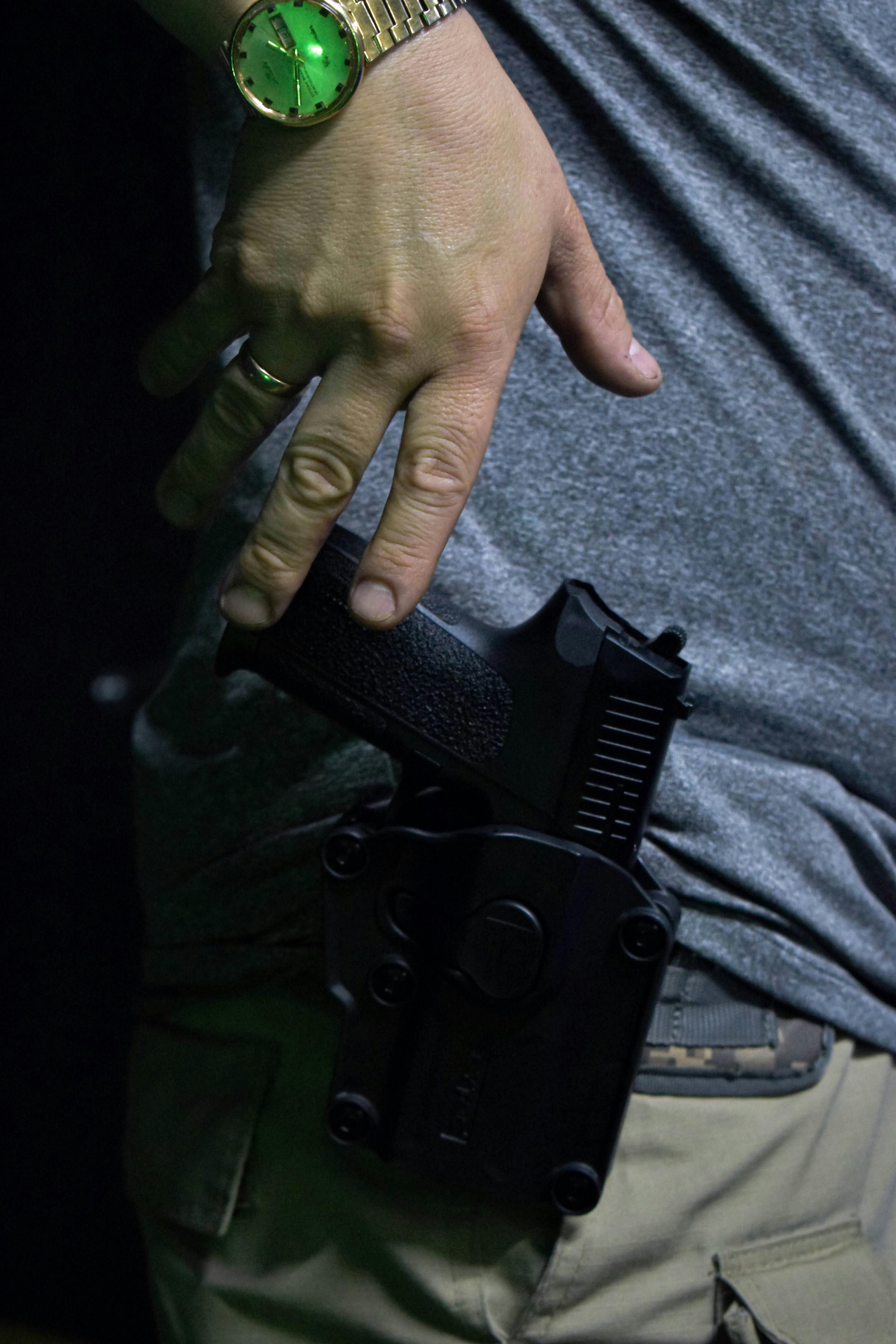 A Police Officer Side Arm in Holster · Free Stock Photo