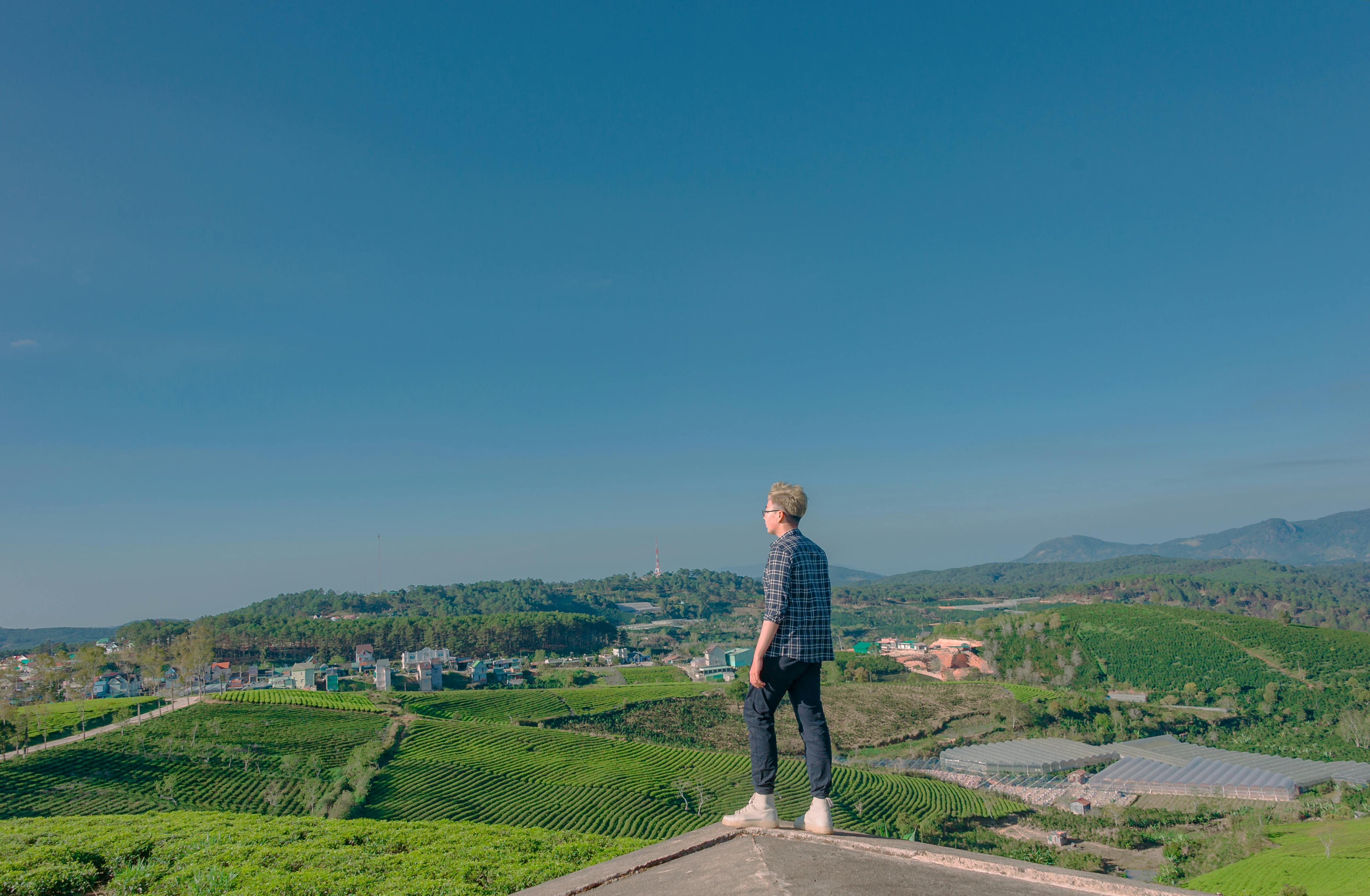 Man Standing on House Roof · Free Stock Photo