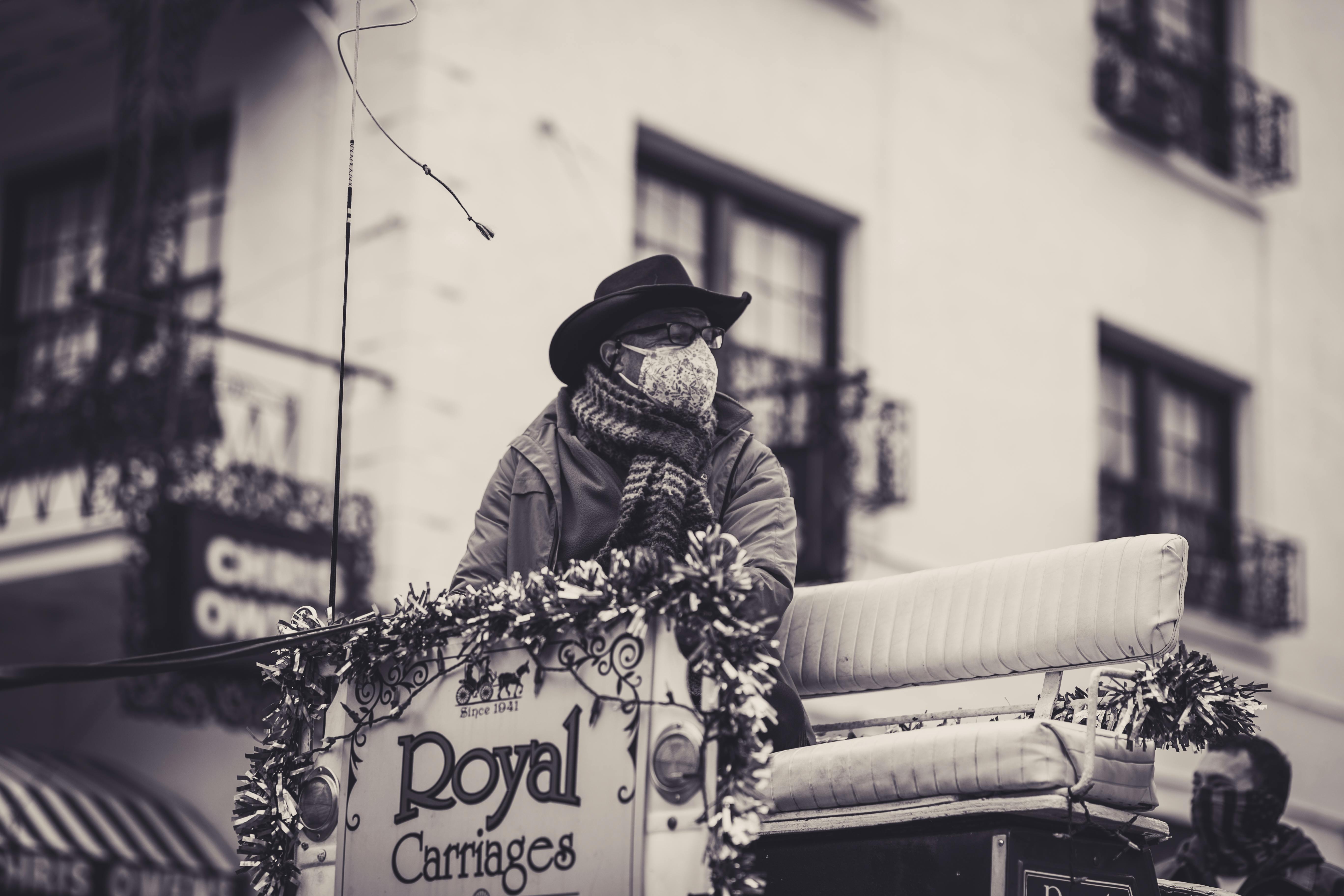 Man Sitting in a Tram in Black and White · Free Stock Photo