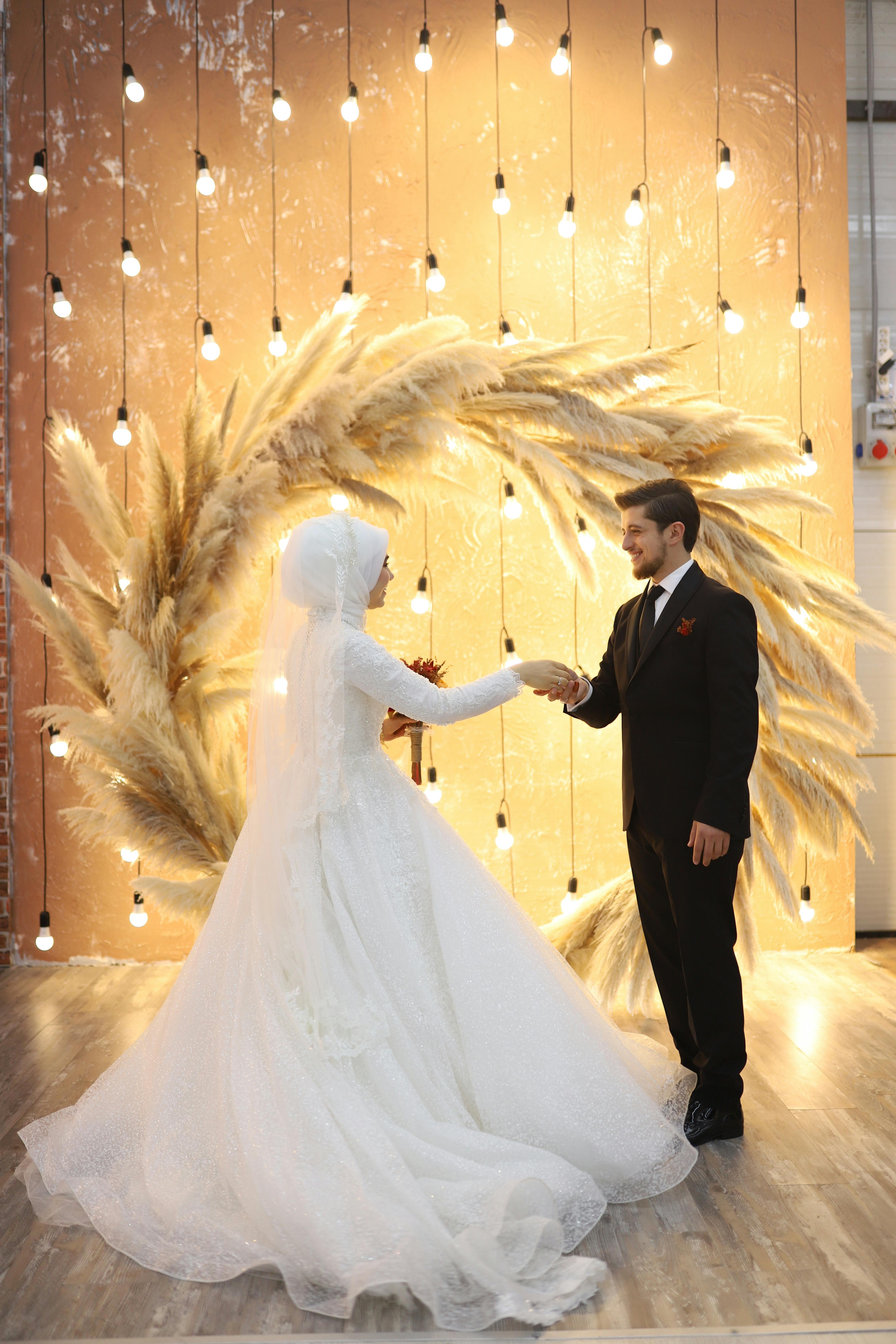 Wedding Couple and Grass Decoration in Background · Free Stock Photo