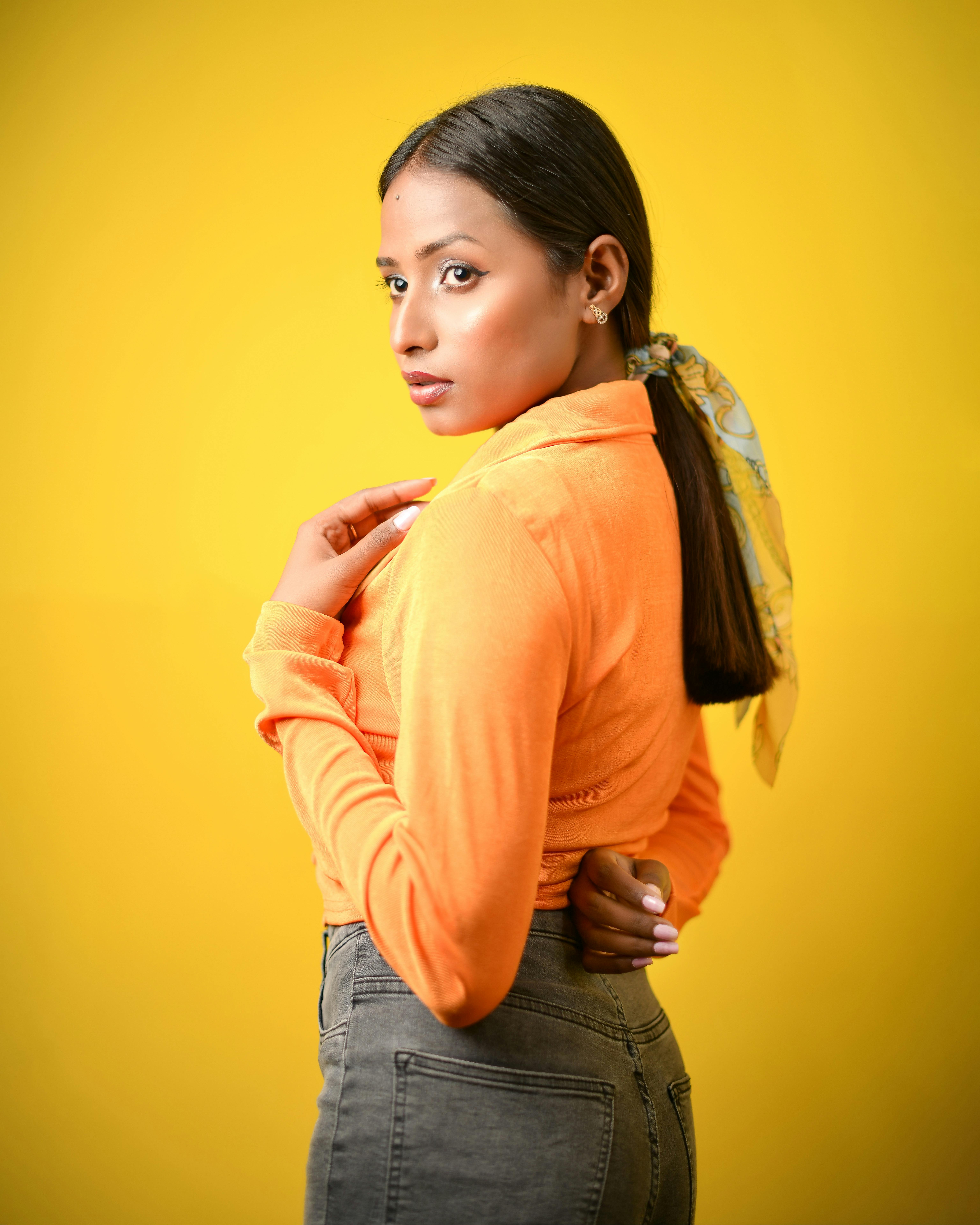 Woman with Her Hand on Her Back · Free Stock Photo
