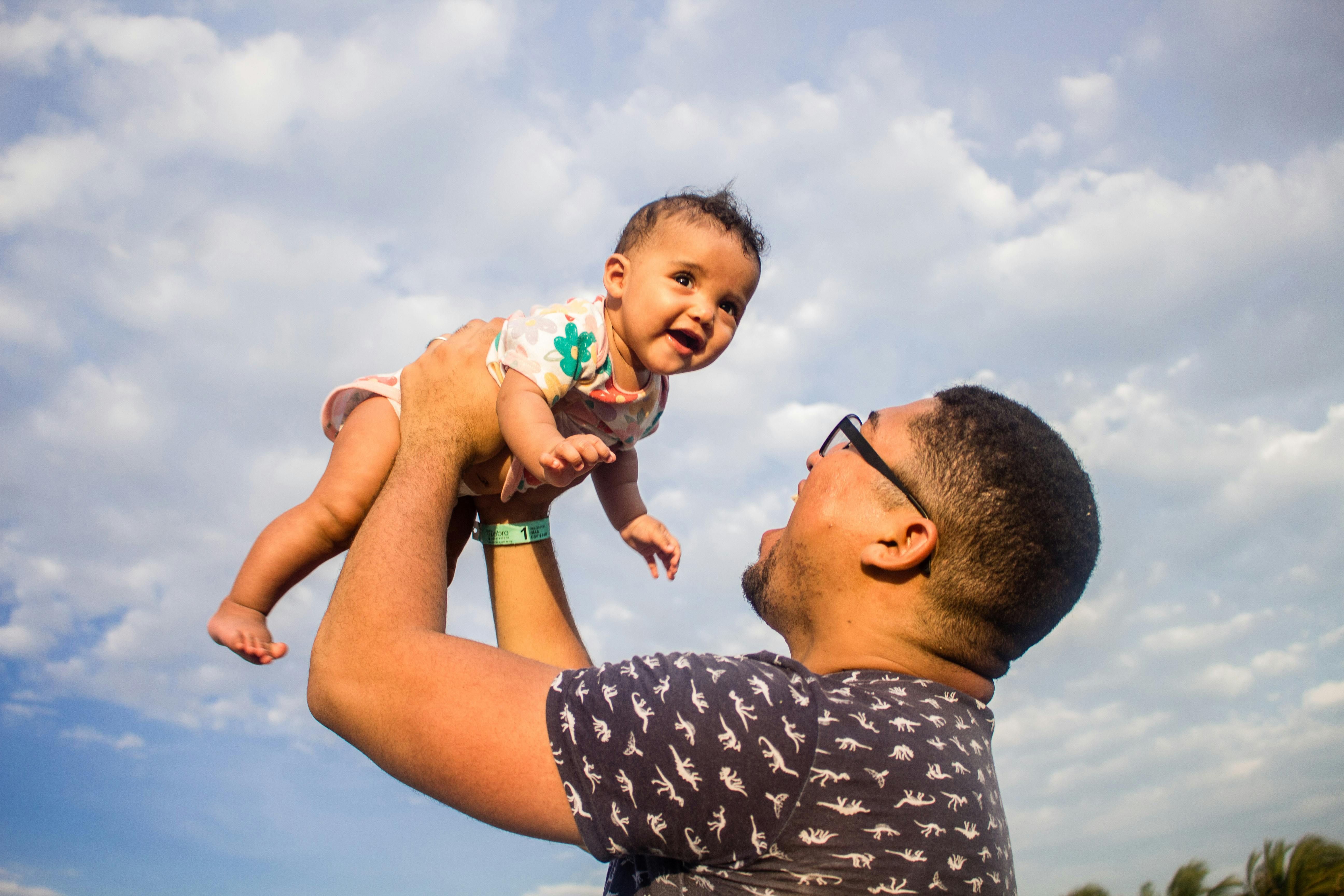 Man Carrying his Baby · Free Stock Photo