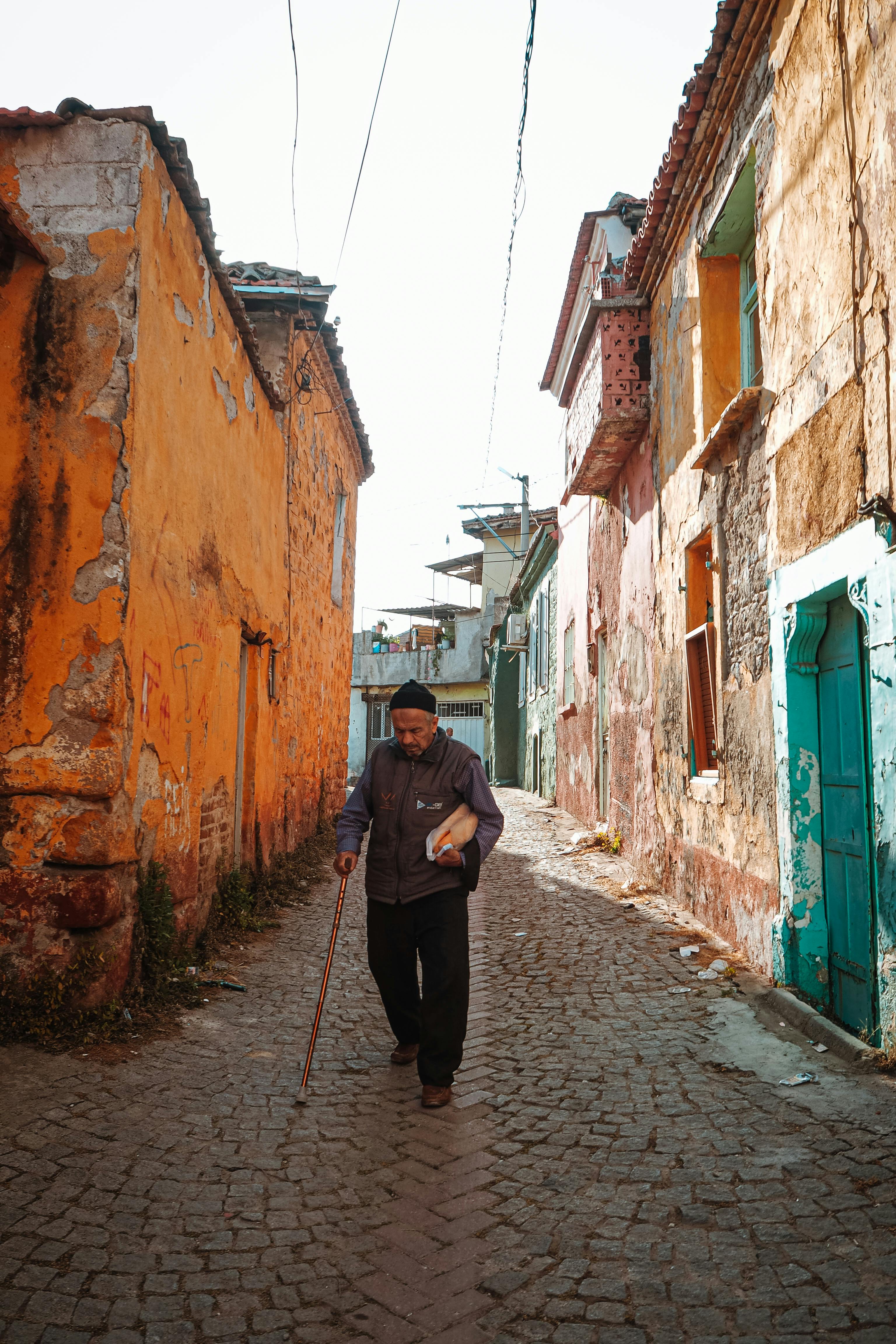 A Man Using Cane While Walking · Free Stock Photo