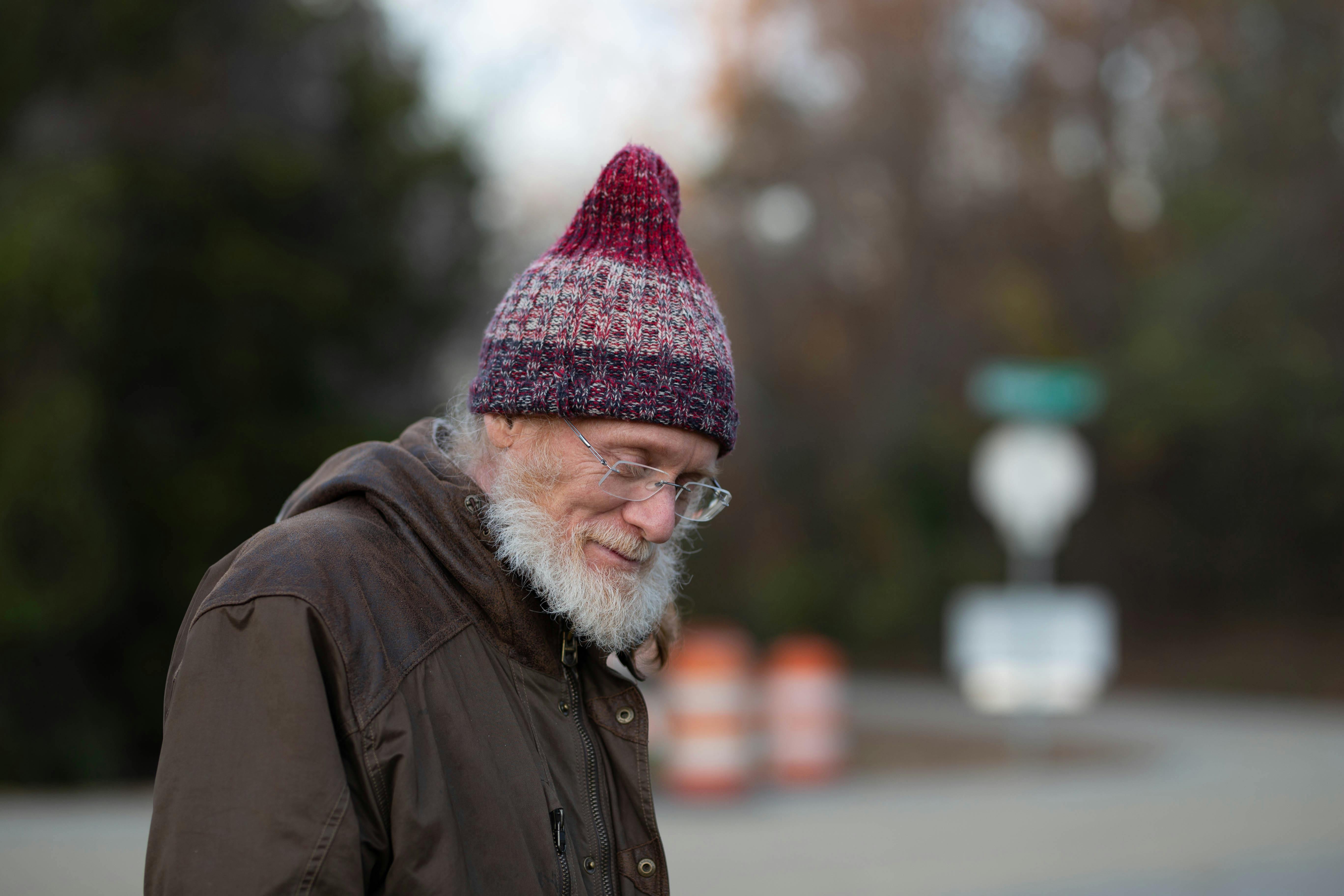 Man in Brown Jacket Busy Writing · Free Stock Photo