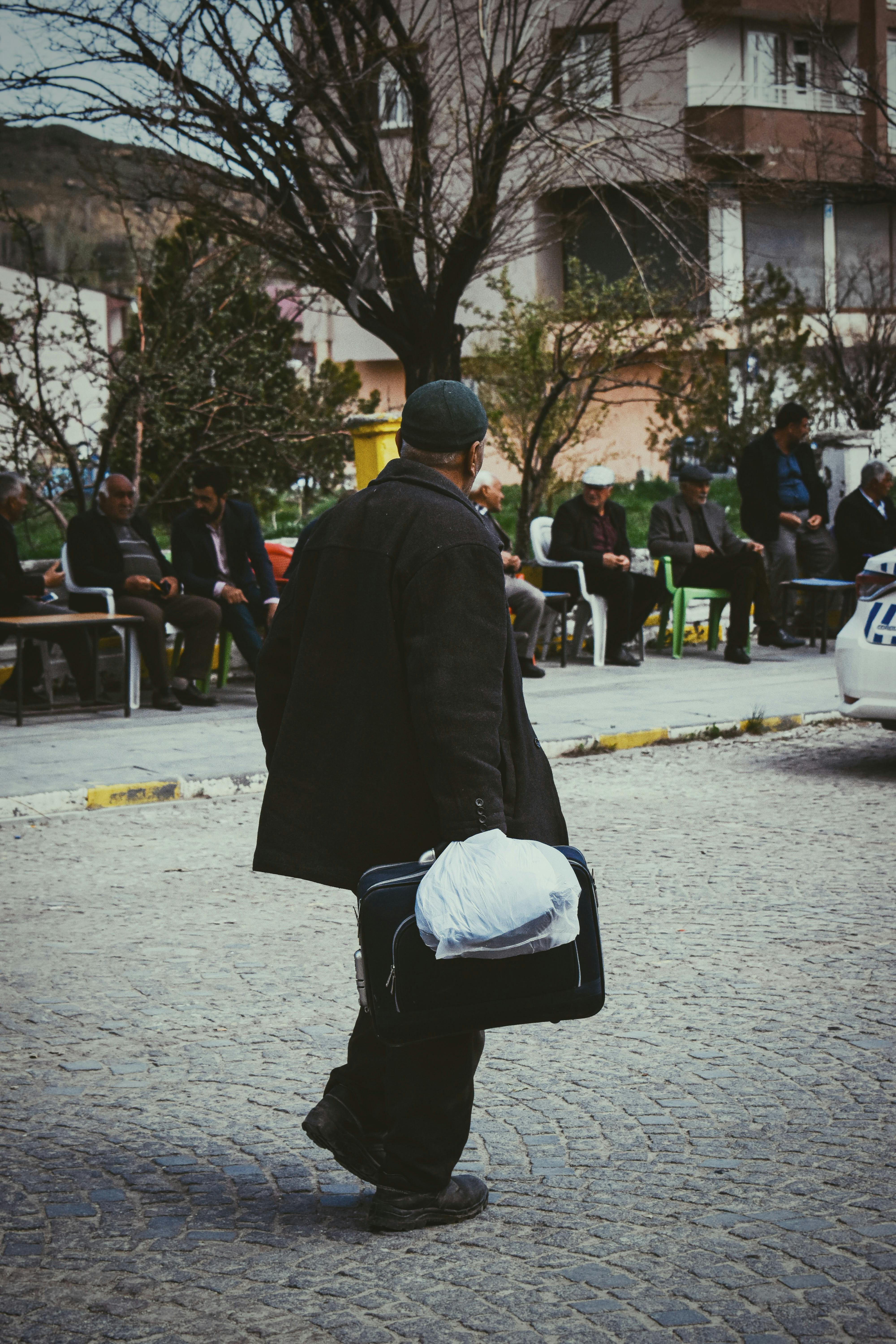 Man Walking in Front of Bakery · Free Stock Photo