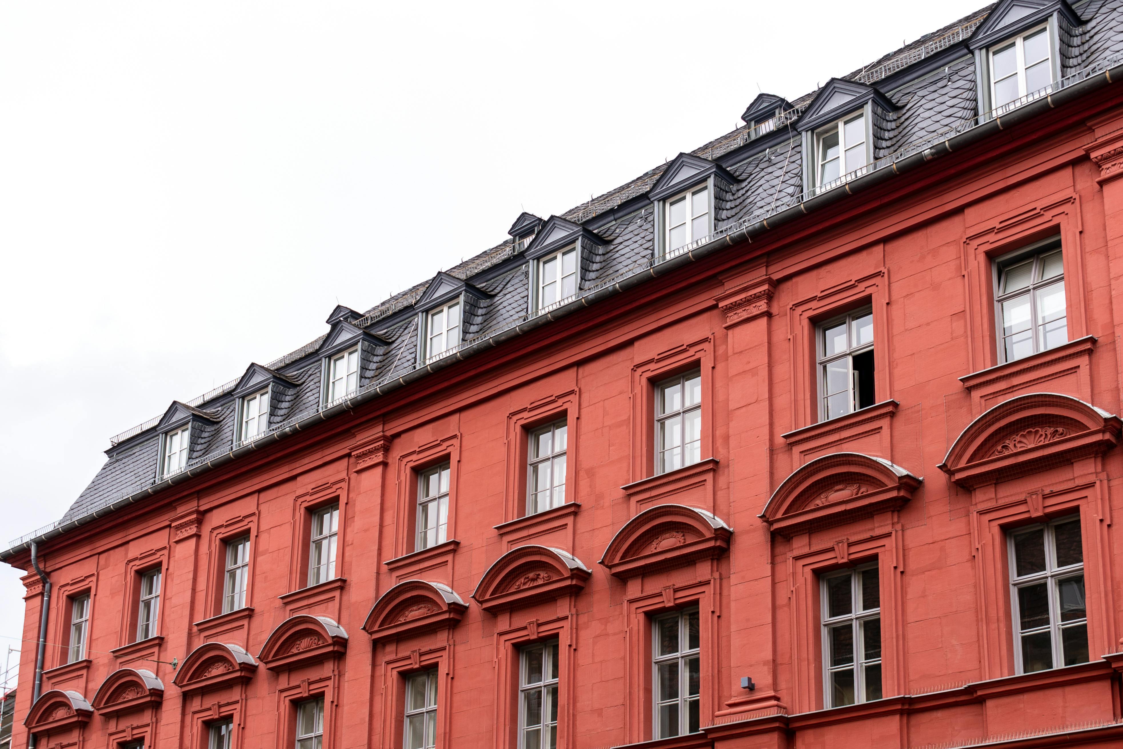Red Awnings Above Windows at a White Building · Free Stock Photo