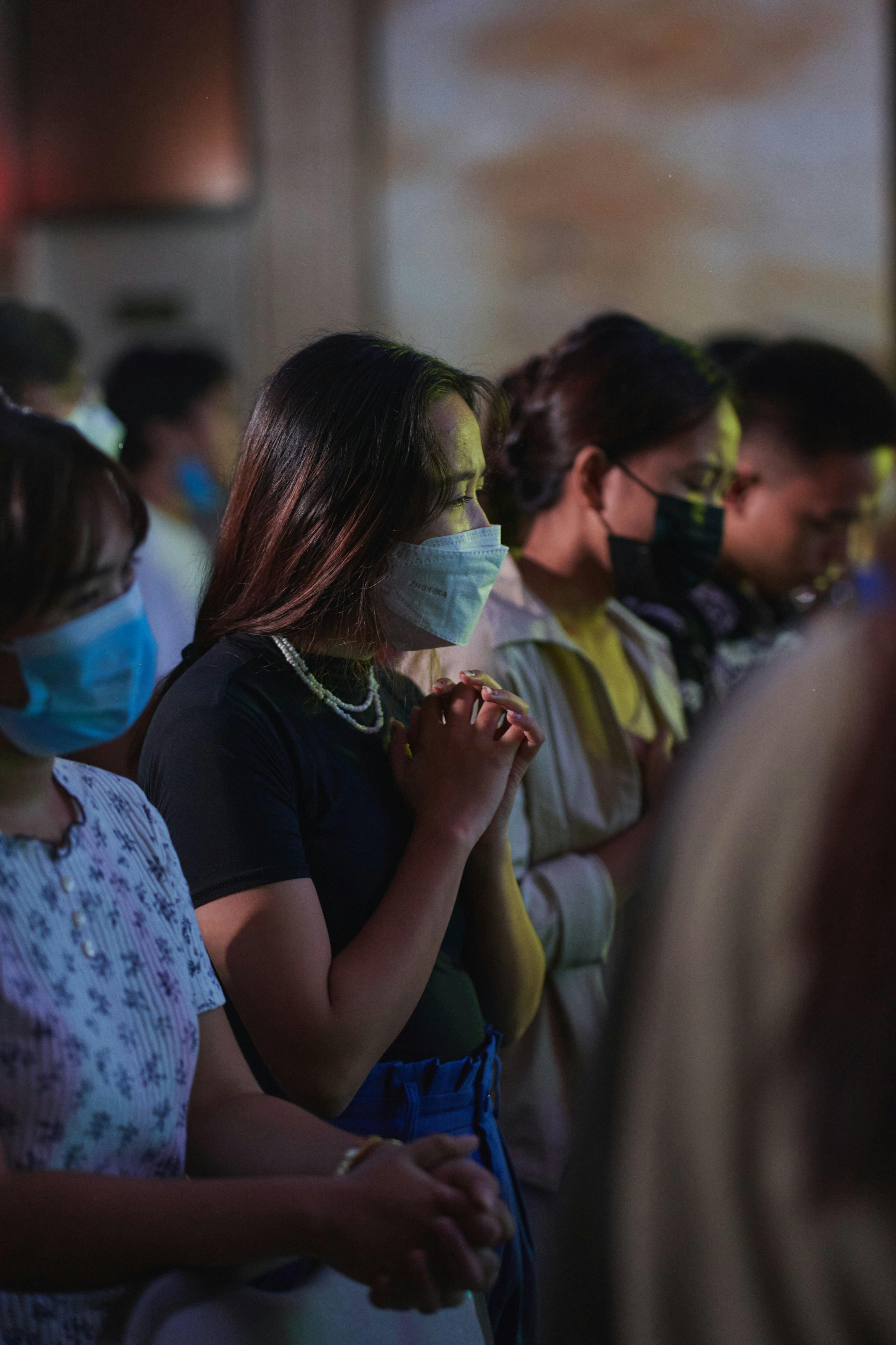 Elderly Woman Praying with Her Hands Together · Free Stock Photo