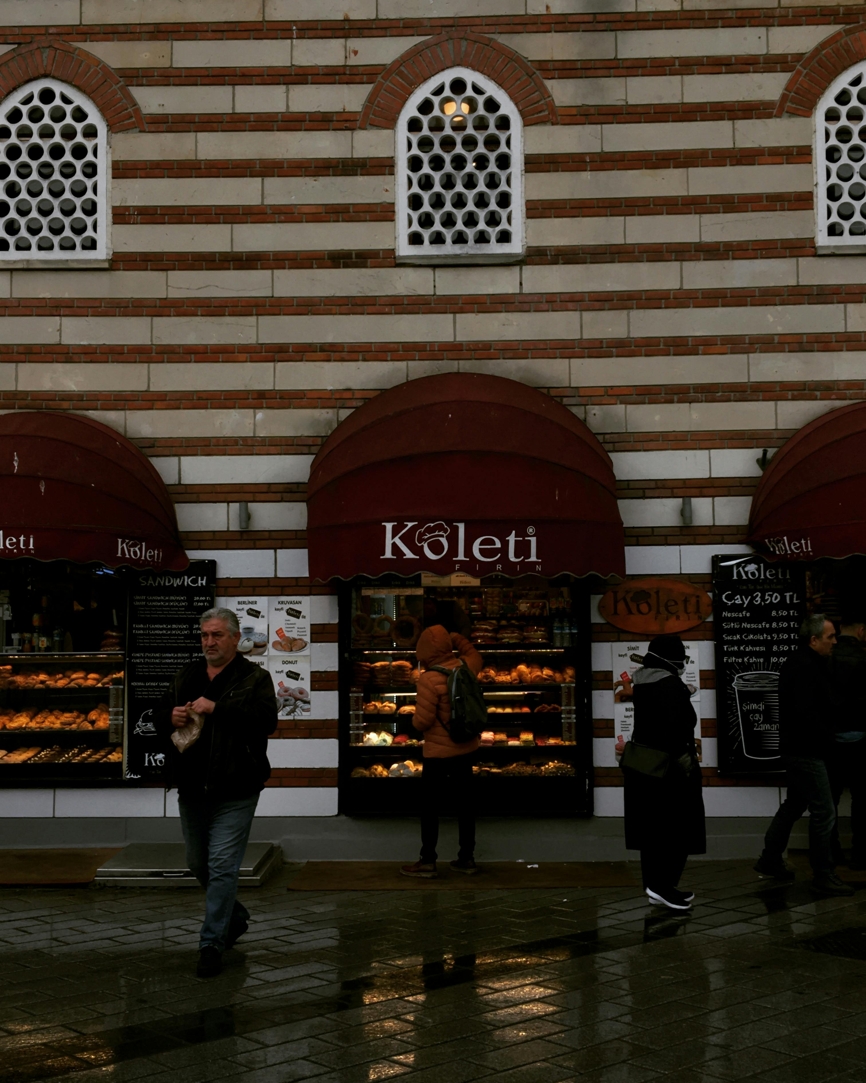 People Near Brown Building · Free Stock Photo