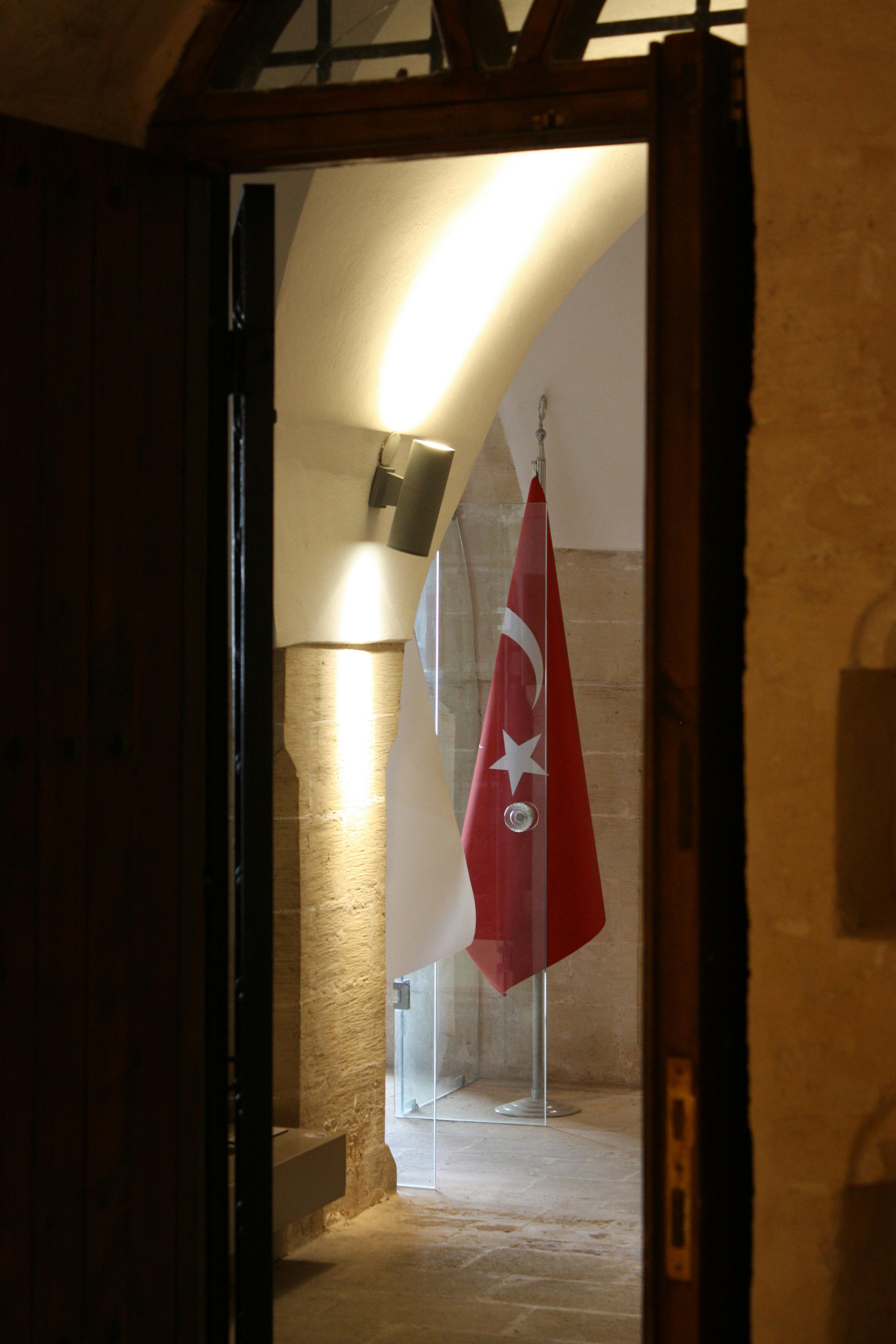 A Flag of Turkey Hanging on a Gate · Free Stock Photo