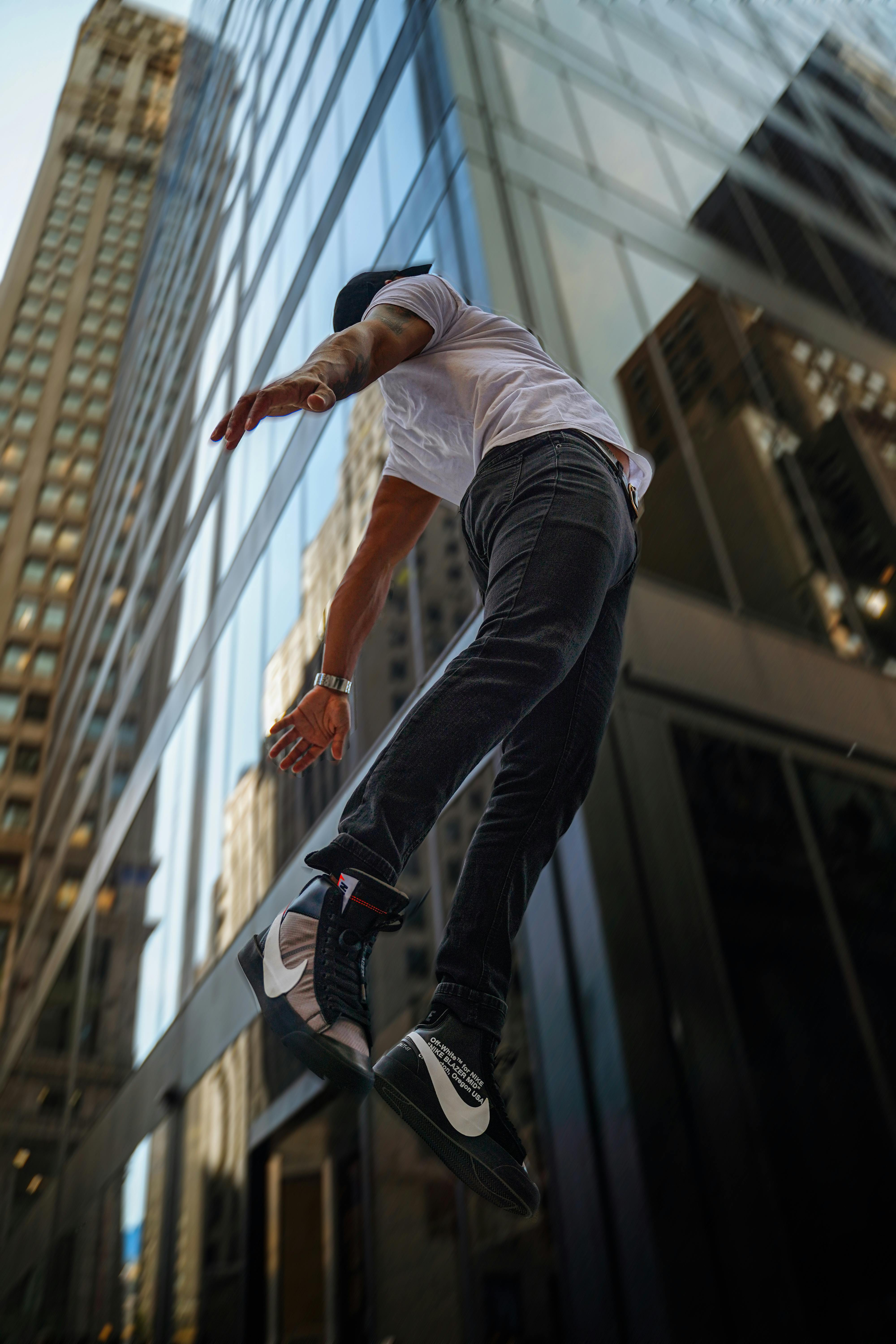 Low Angle Shot of Man on Mid Air · Free Stock Photo