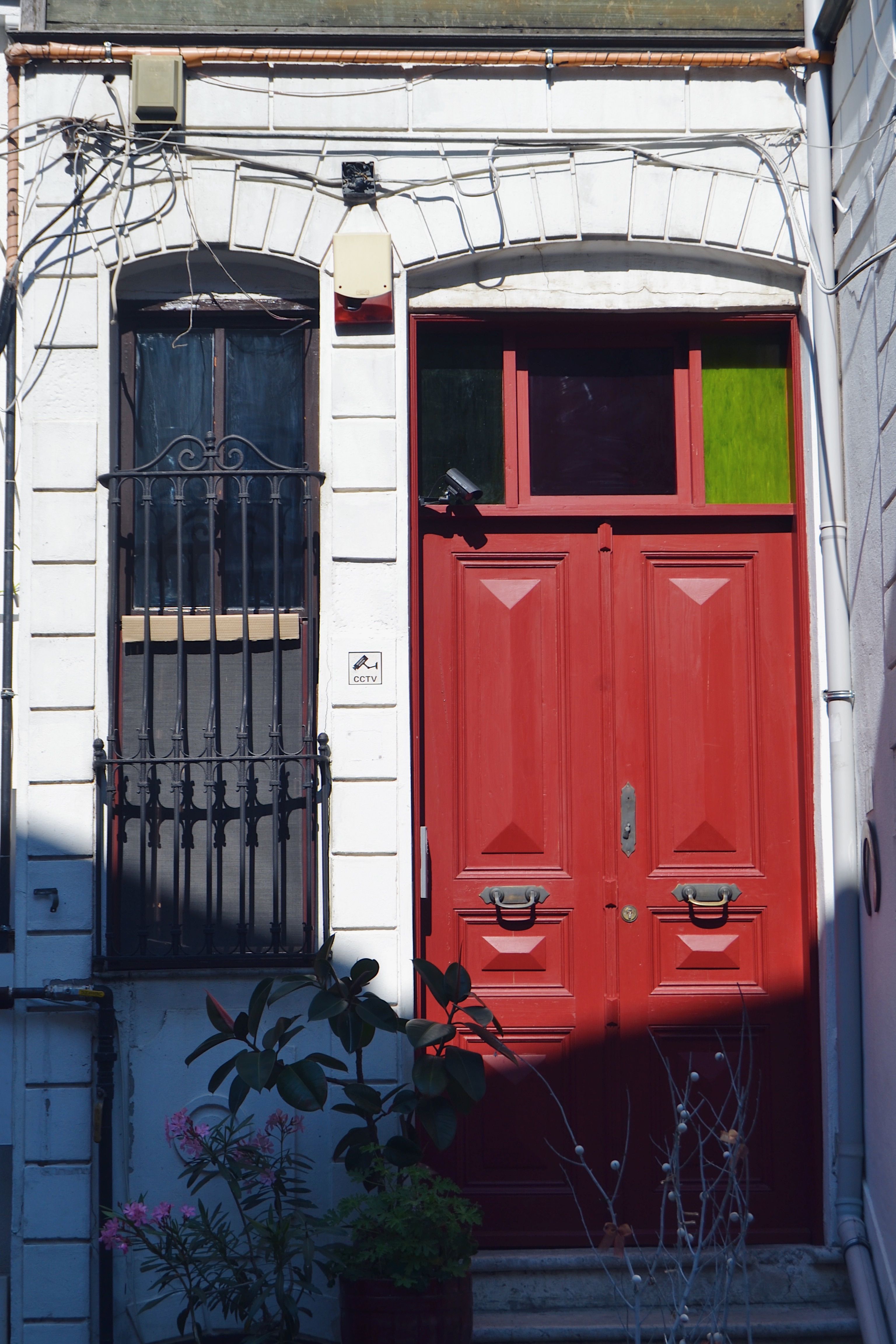 Red Wooden Door on Abandoned Building · Free Stock Photo