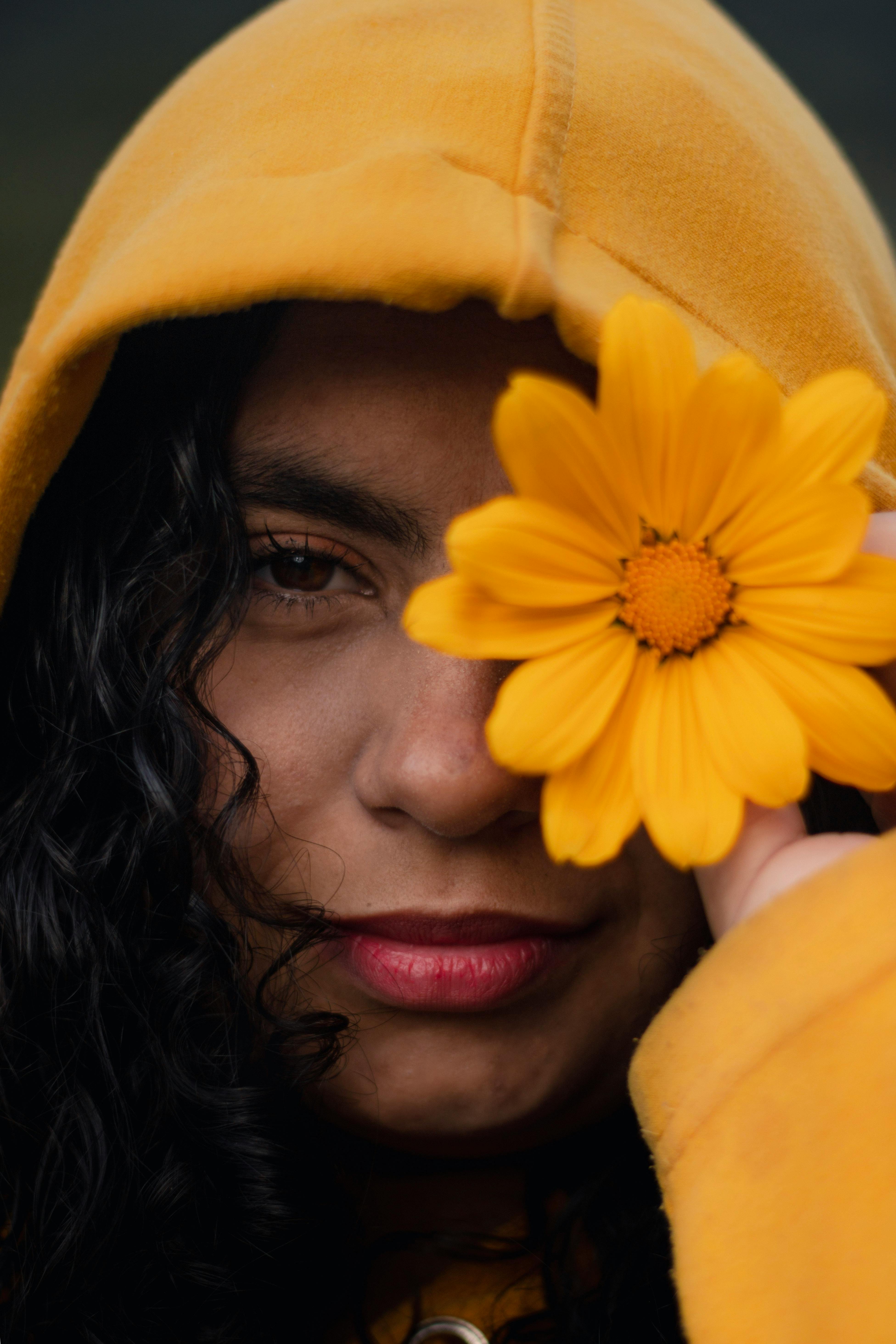 A Woman Biting a Flower · Free Stock Photo