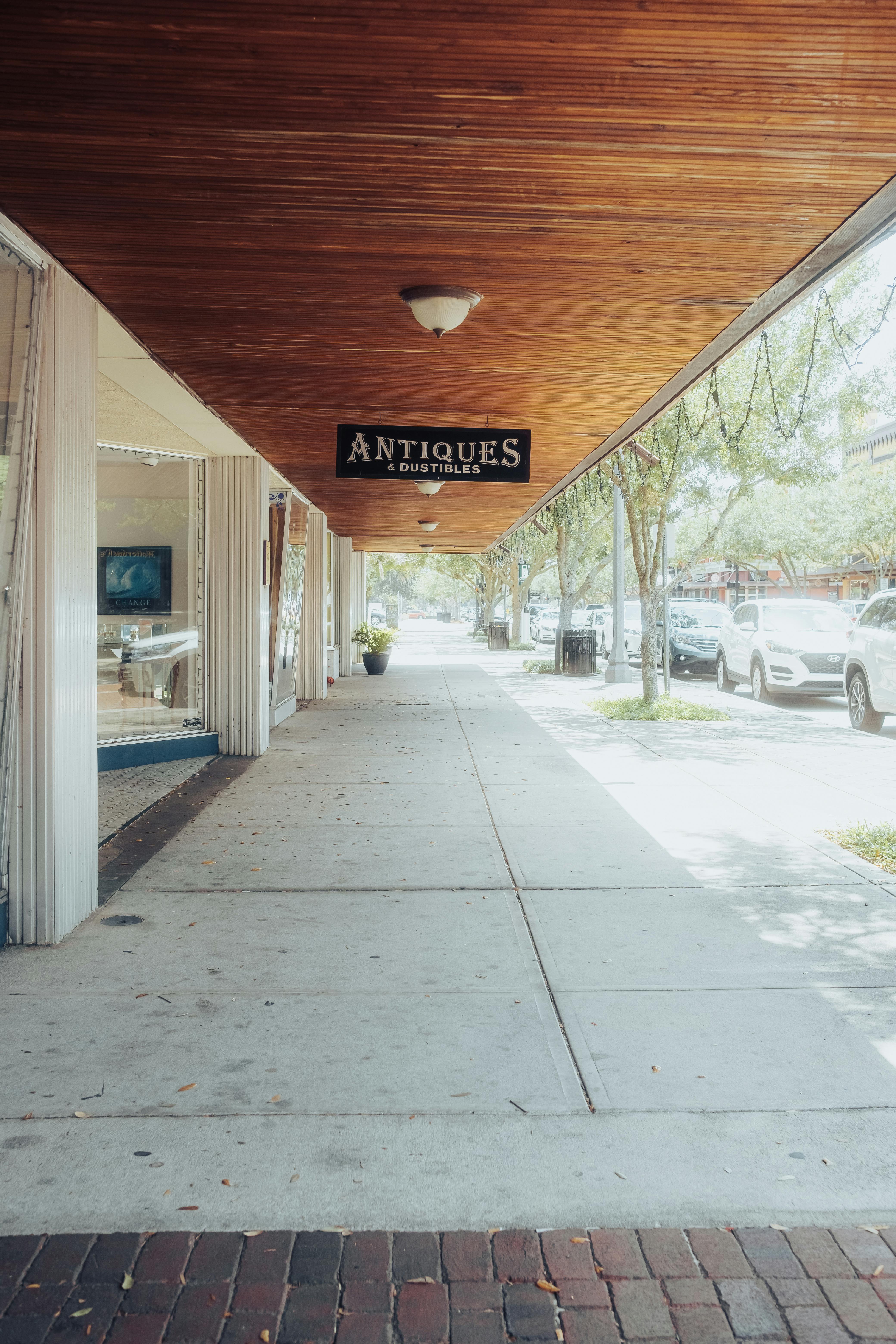 Shop Sign Outside Building · Free Stock Photo