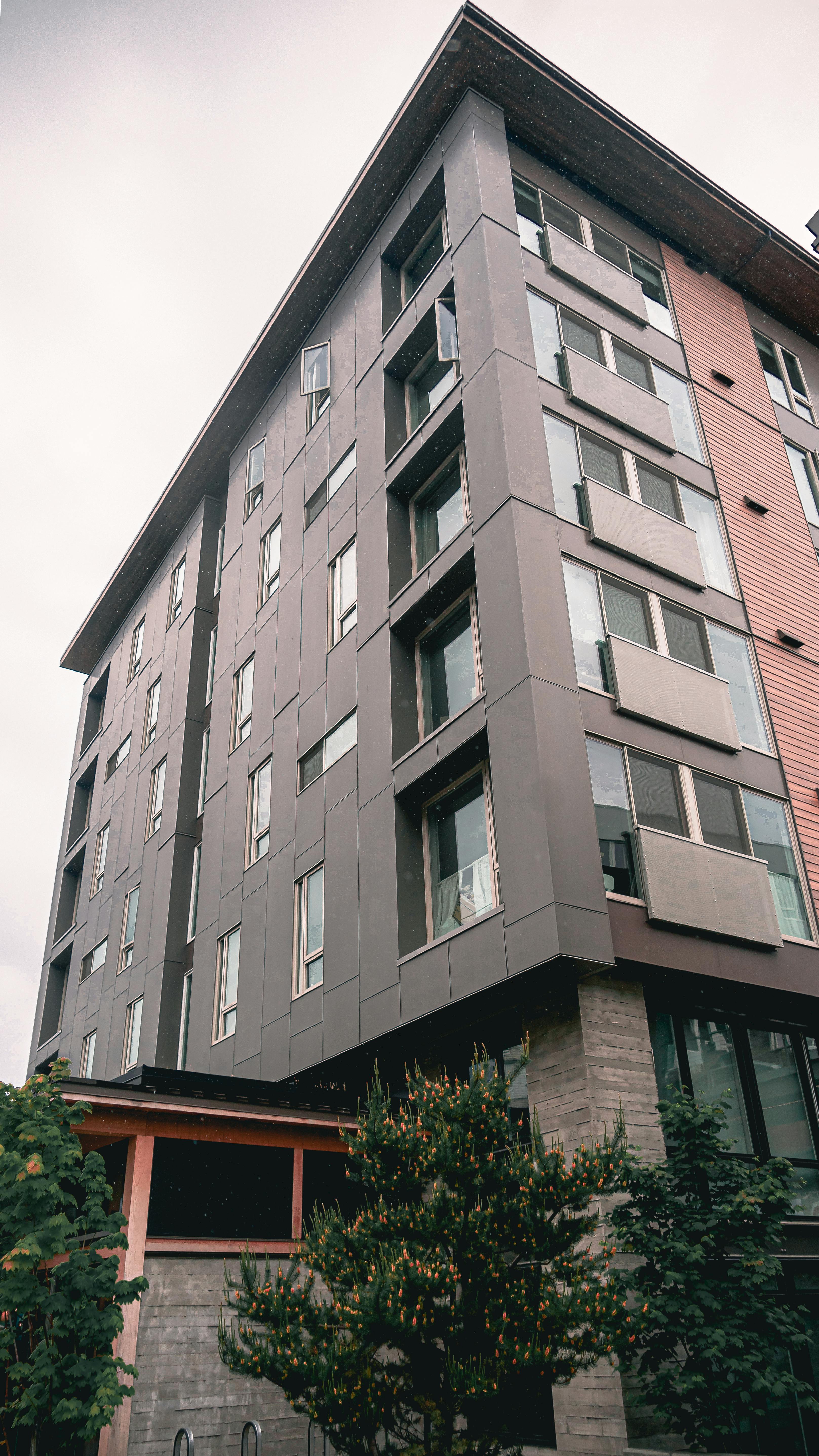 A Monorail Train Between High Rise Buildings · Free Stock Photo