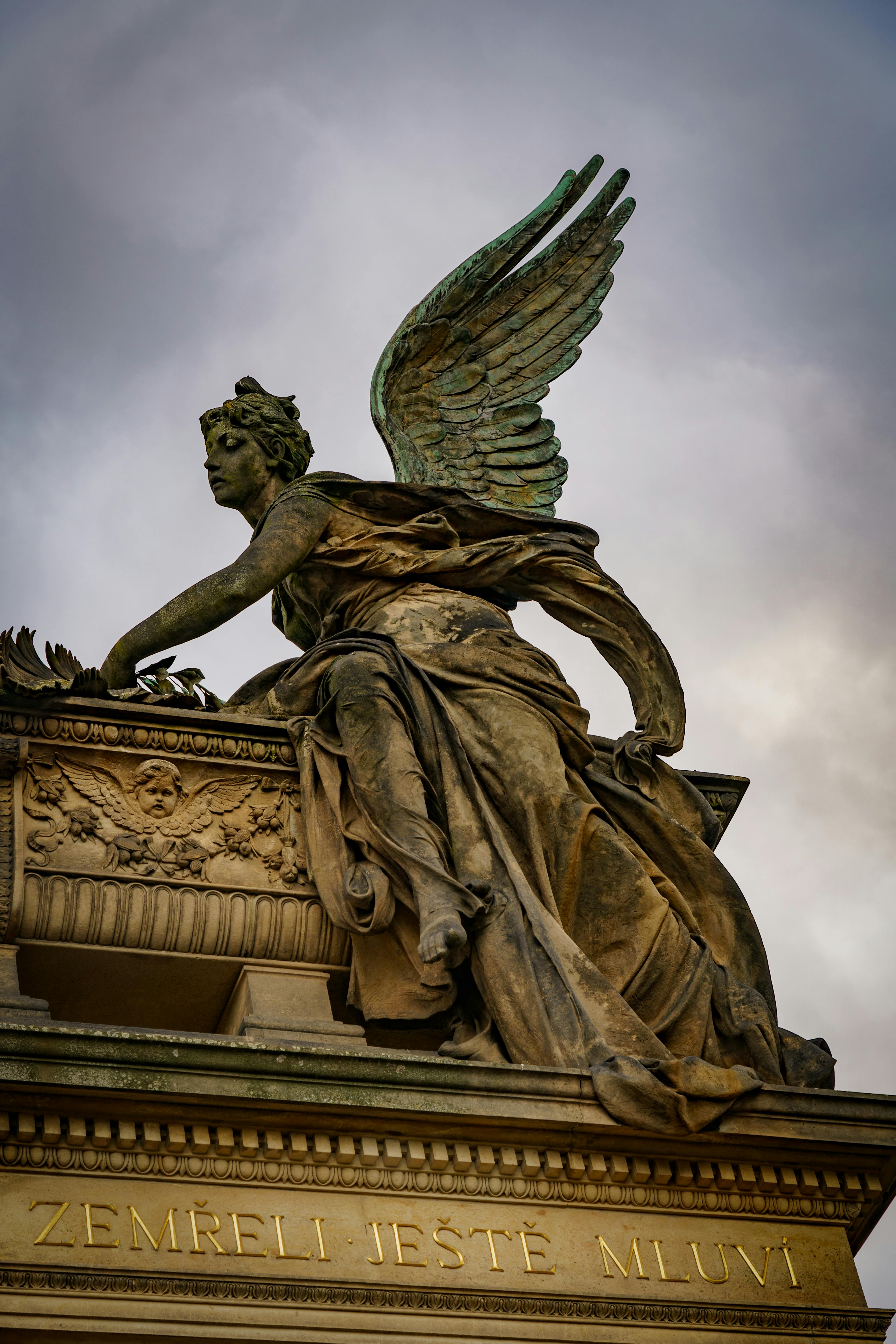 A Stone Statue of People Sitting · Free Stock Photo
