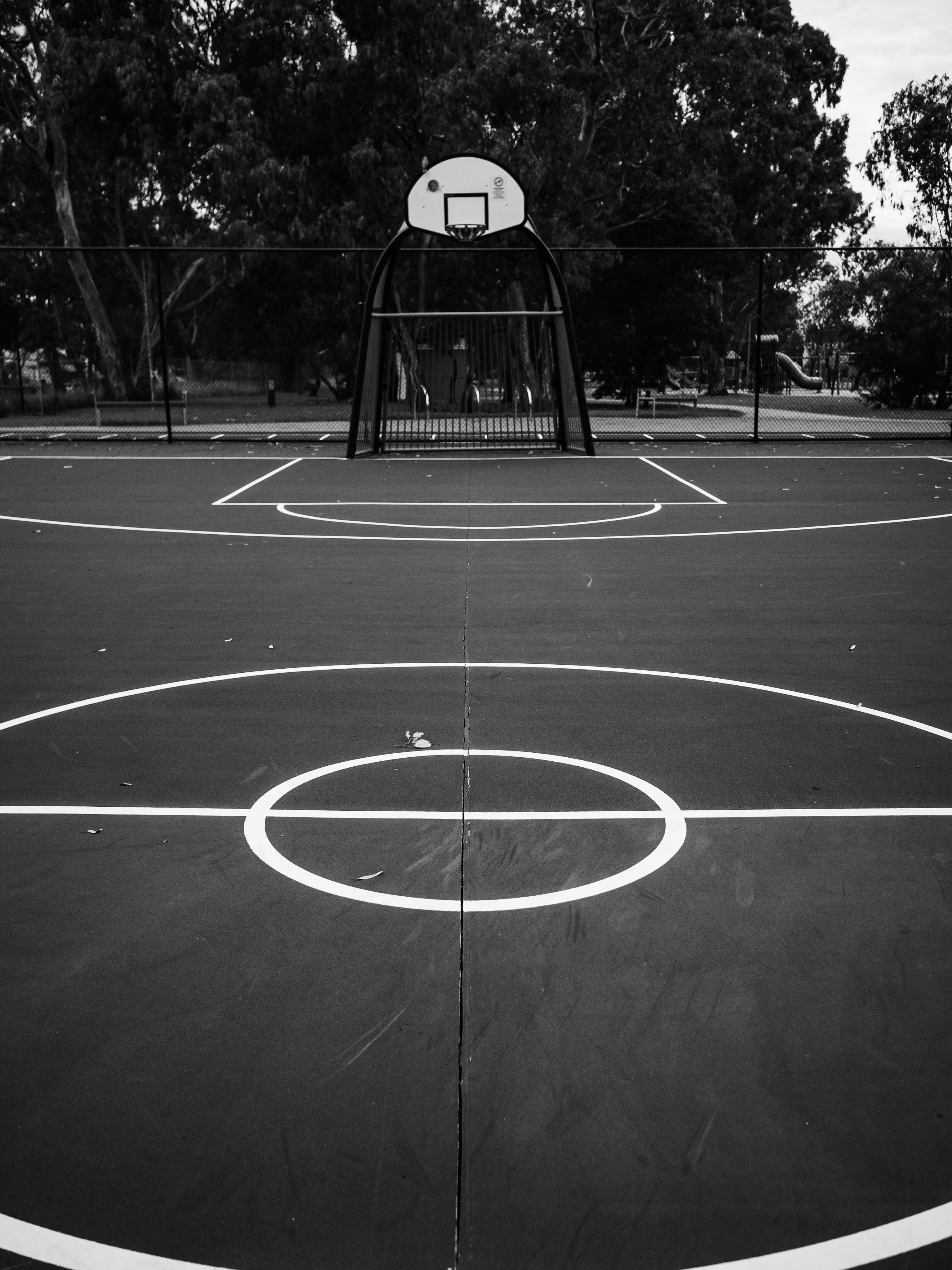 Grayscale Photo of Basketball Court · Free Stock Photo