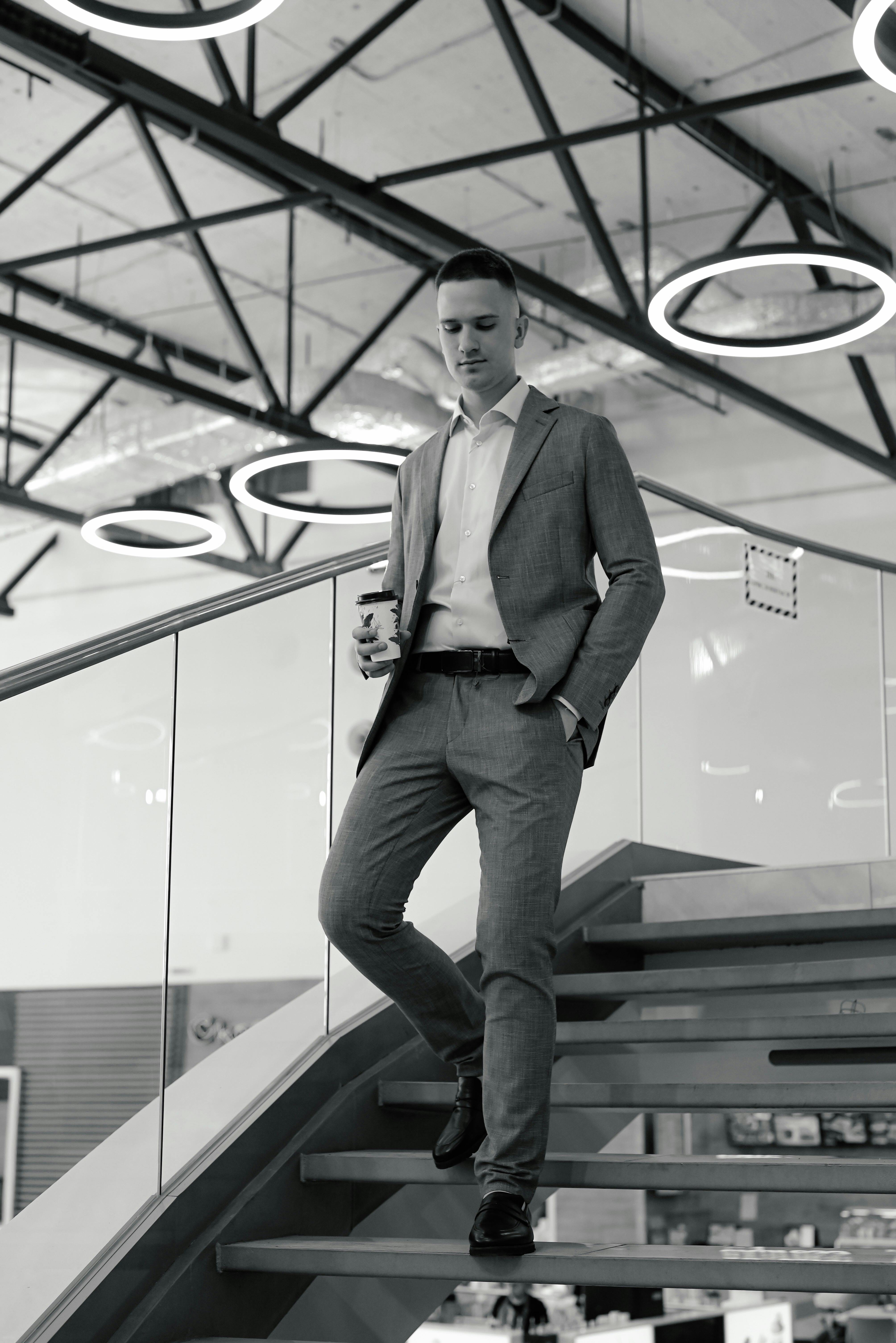 Man walking down the old stone staircase · Free Stock Photo