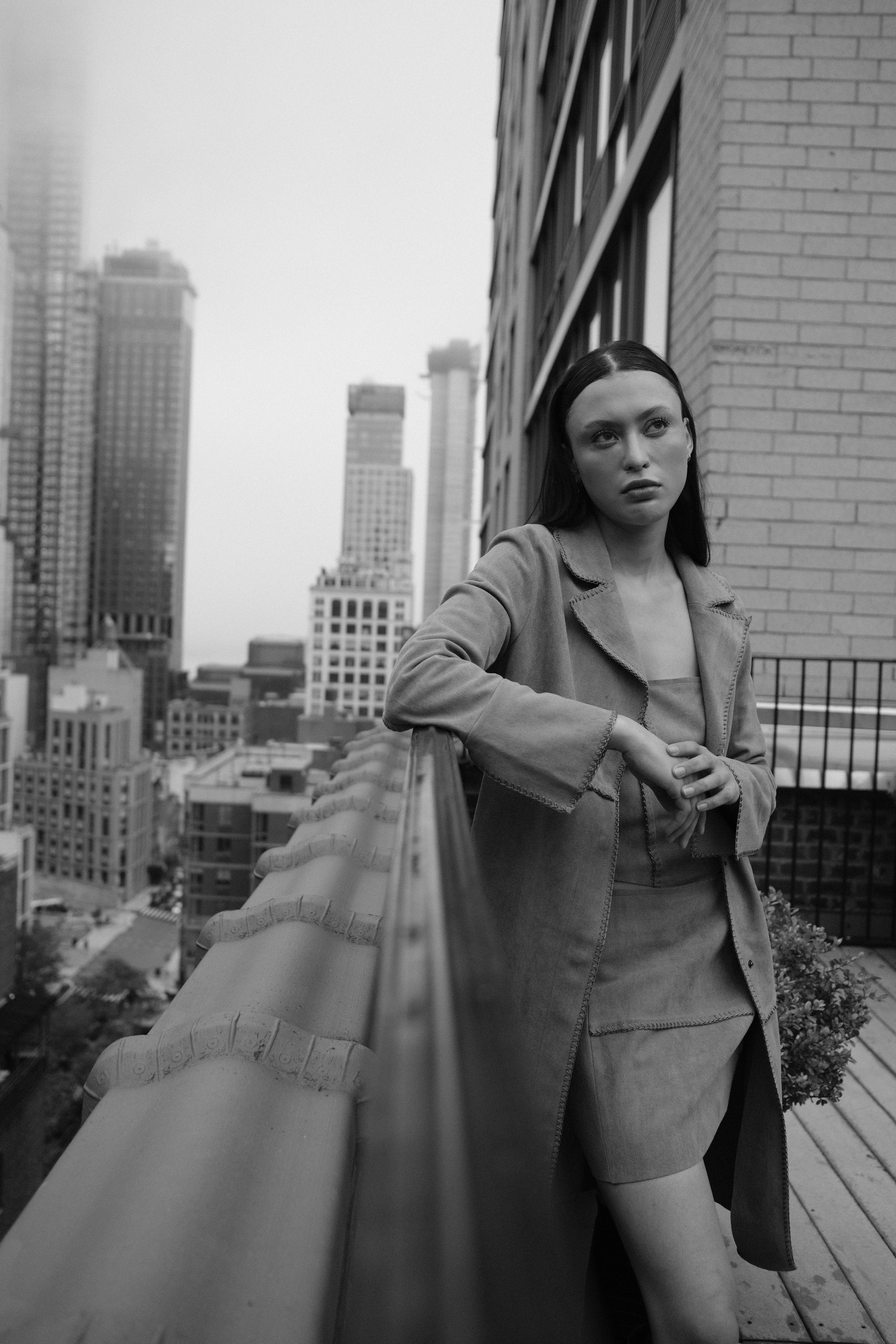 Beautiful Woman Model on a Balcony in a City · Free Stock Photo