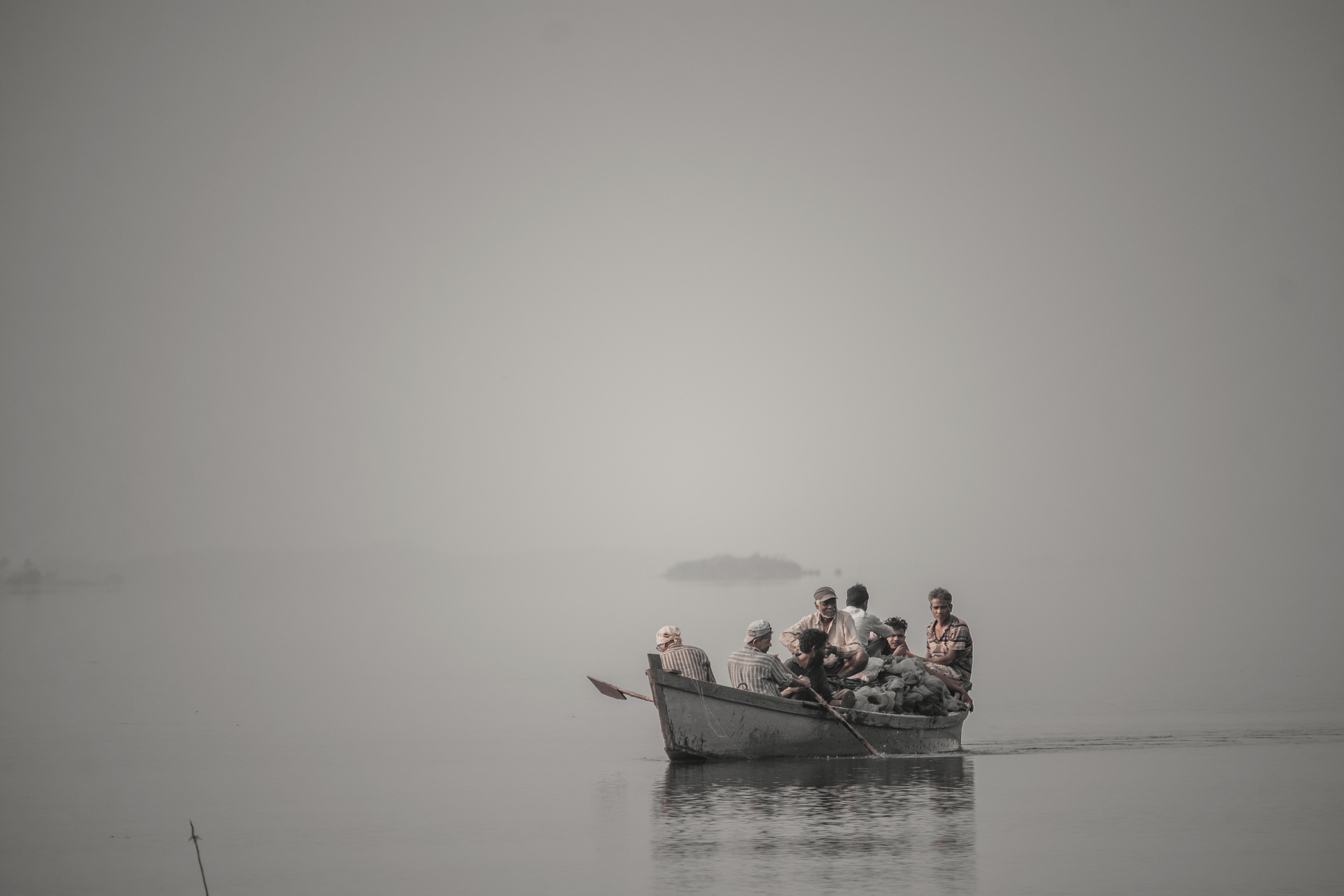 Group of Man on a Boat · Free Stock Photo
