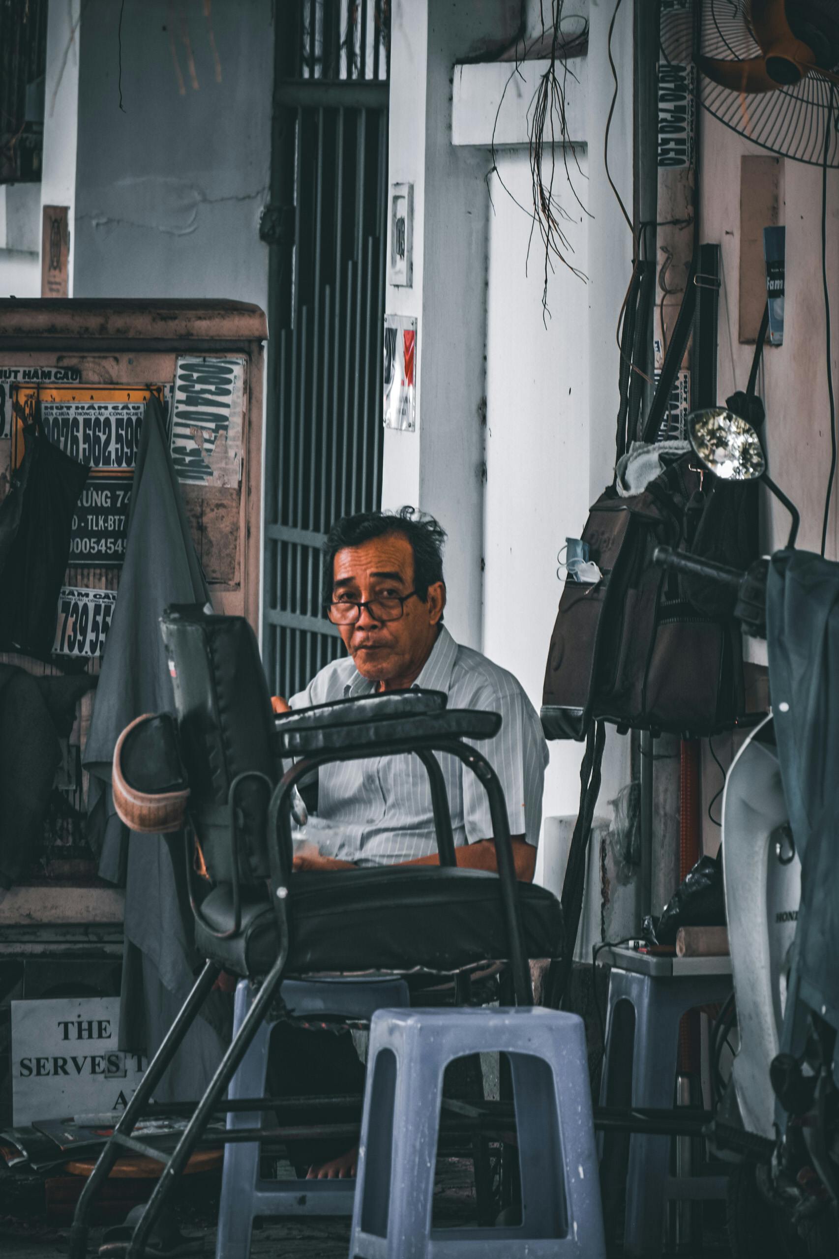 Street Barber with His Setup on a Sidewalk · Free Stock Photo