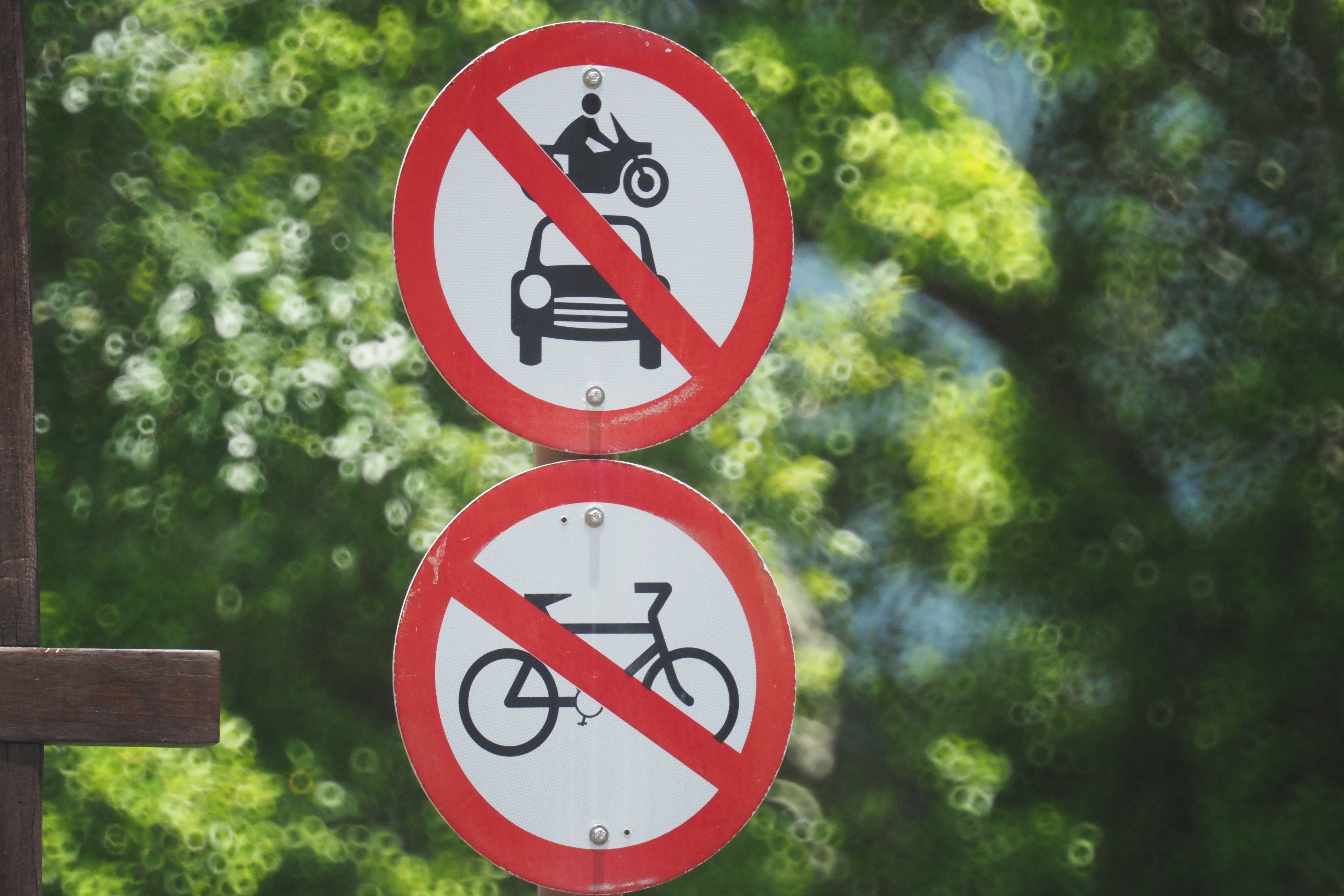 Wooden Road Signages on Green Grass Field · Free Stock Photo