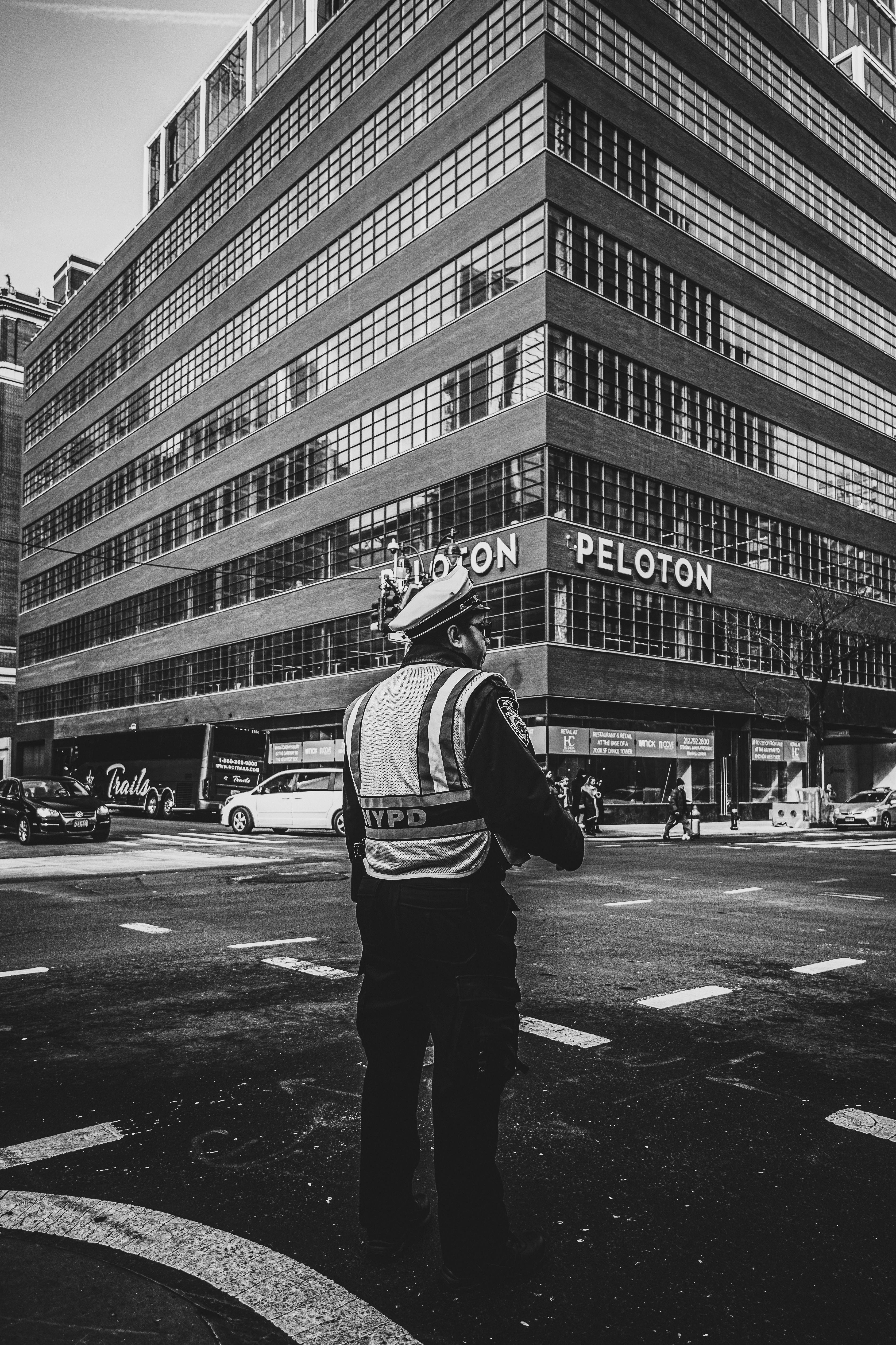 Police Officer Standing on a City Street · Free Stock Photo