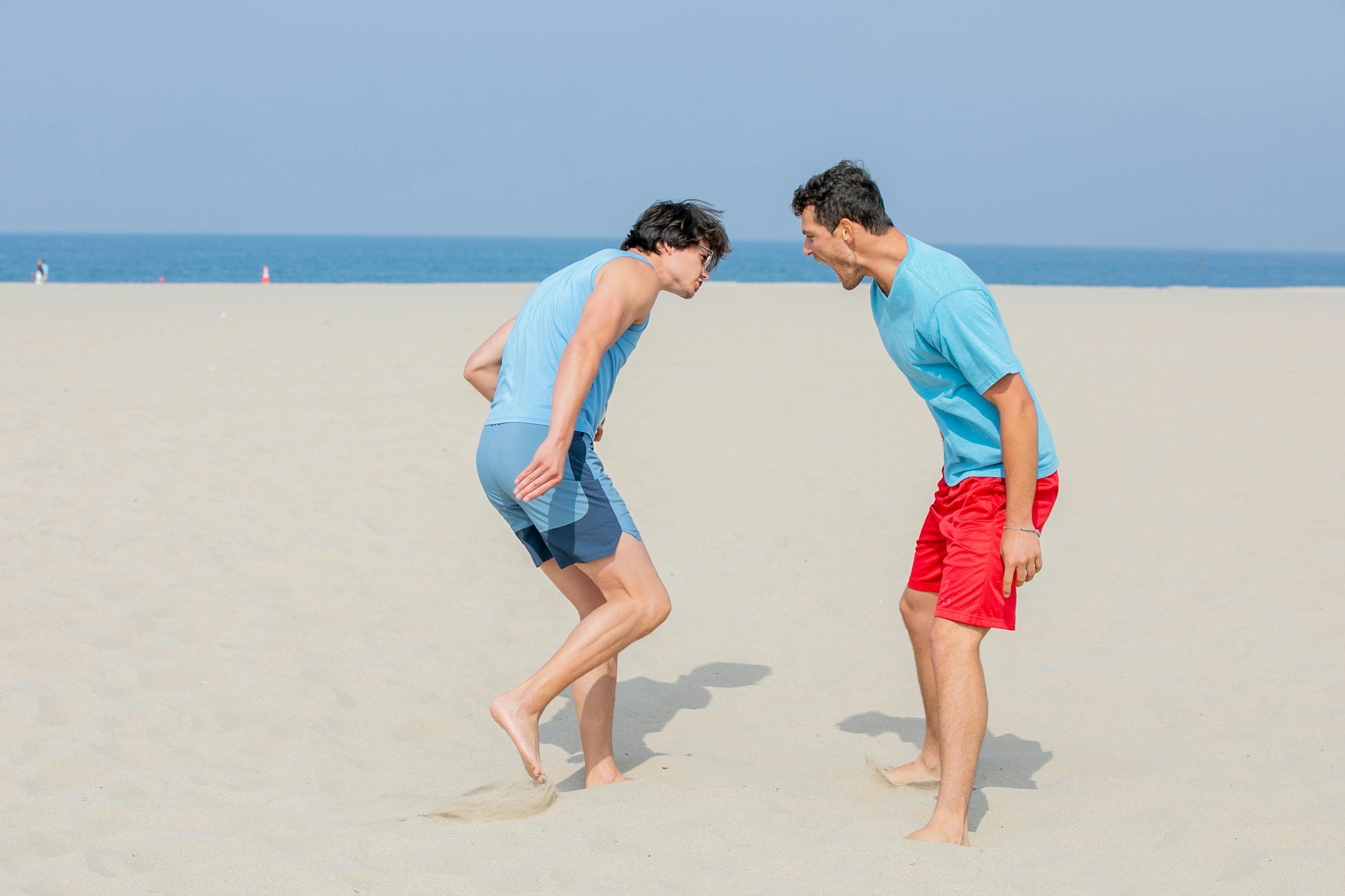 One Man Shouting at the Other on a Beach · Free Stock Photo
