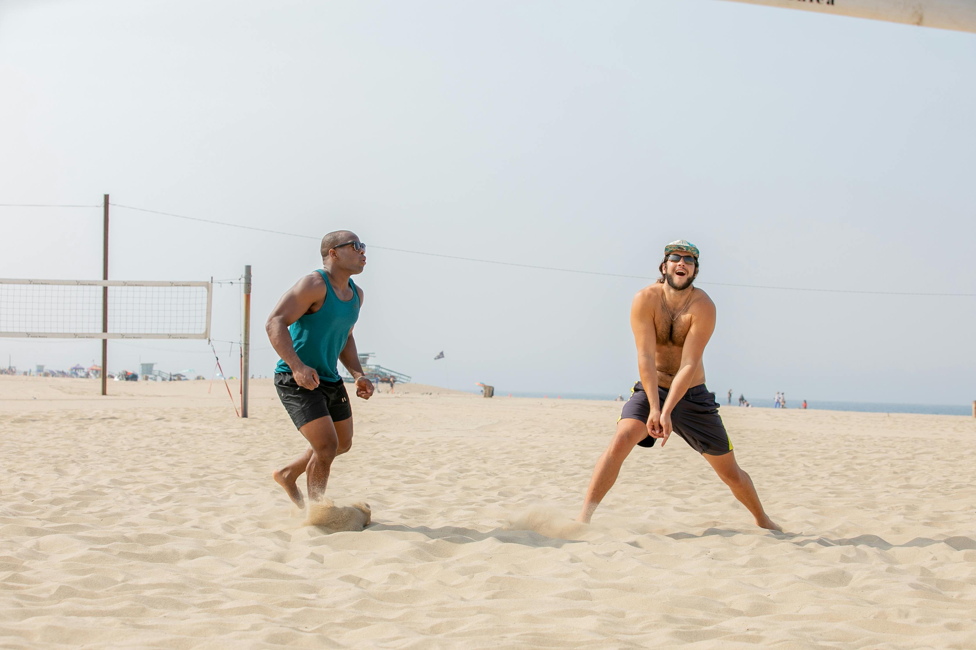 Men Playing Beach Volleyball Free Stock Photo