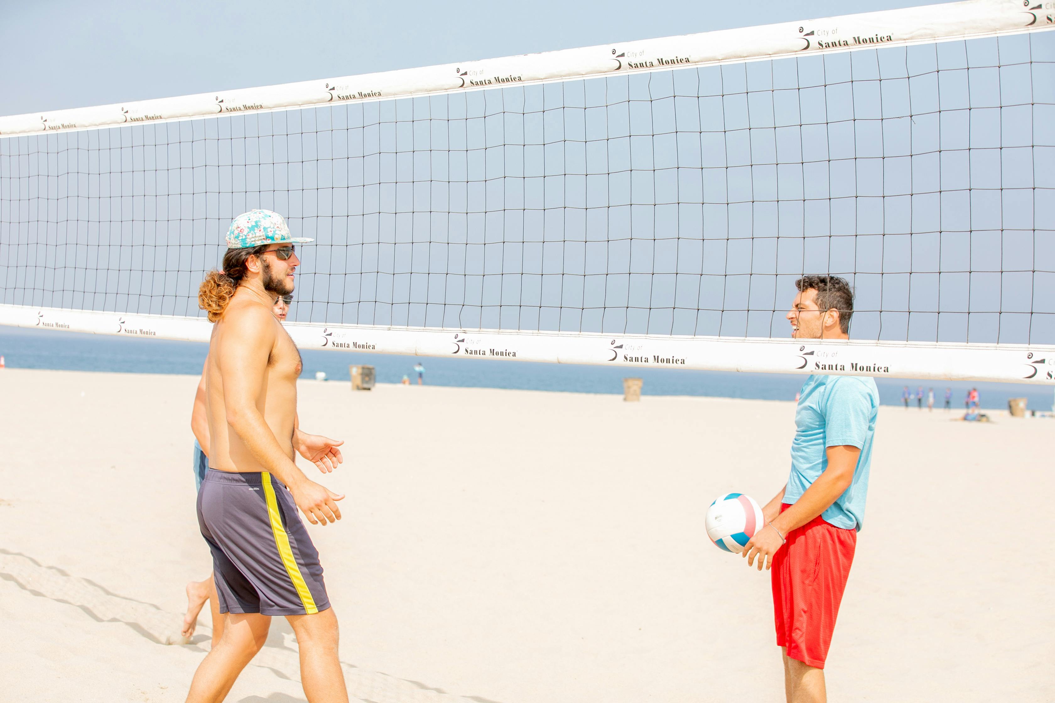 Men Playing Beach Volleyball Free Stock Photo