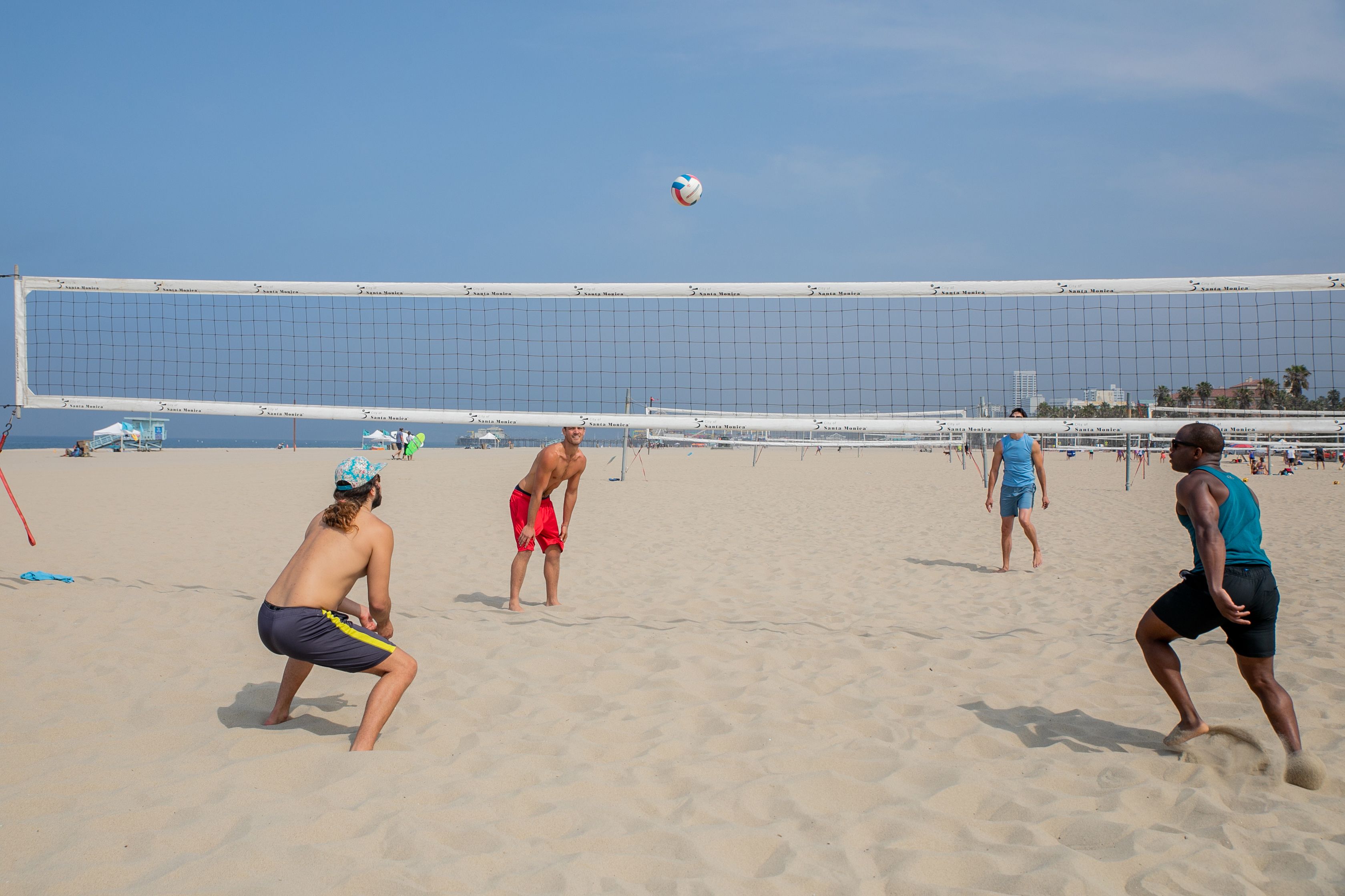 Photo of Groups of People Playing Beach Volleyball · Free Stock Photo