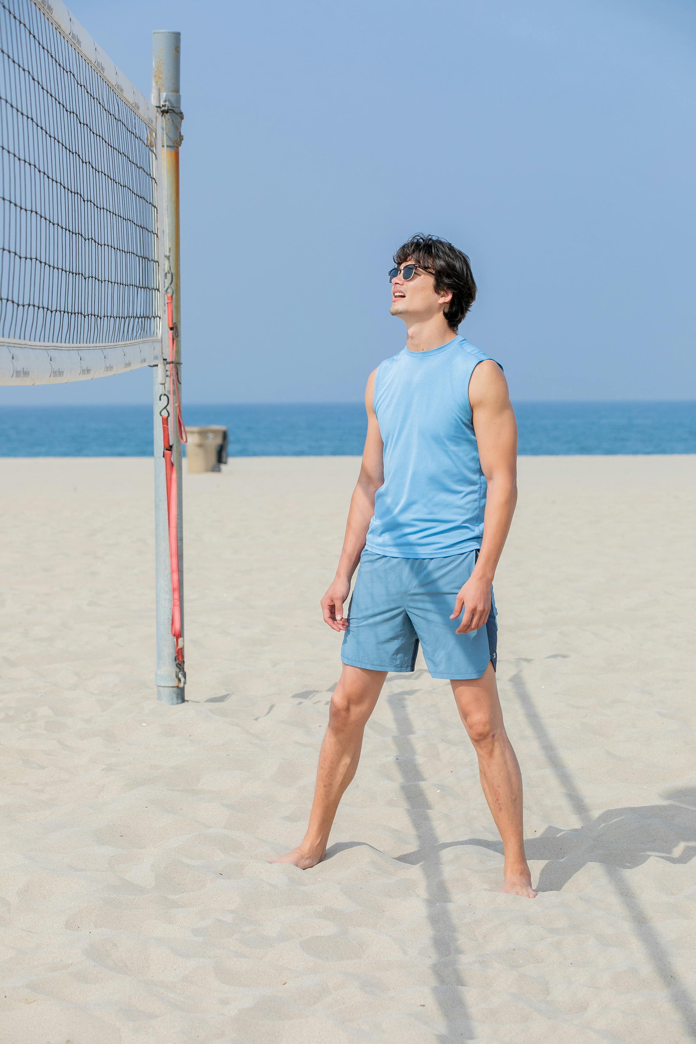 Laughing Man Falling During a Volleyball Game with a Woman · Free Stock ...