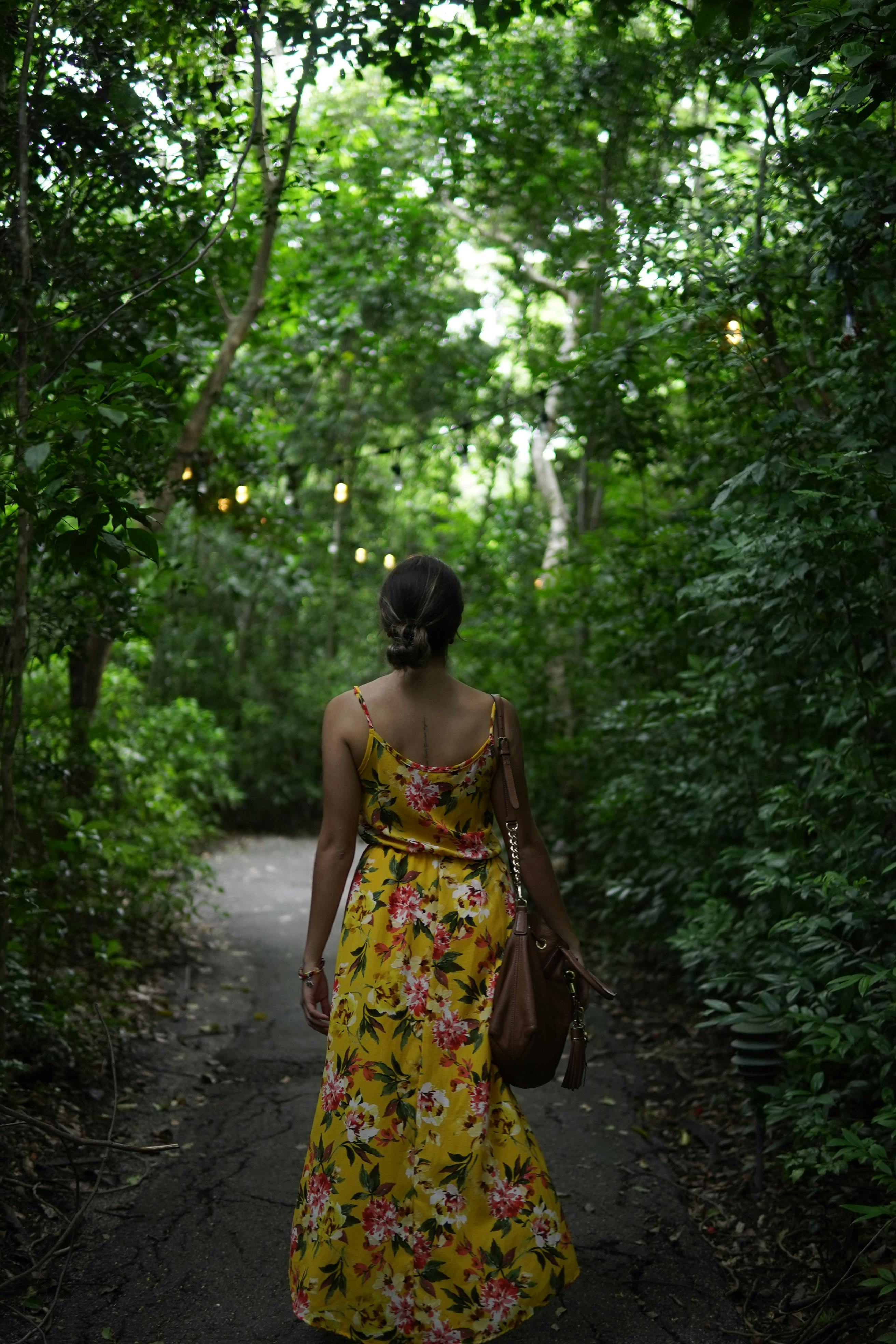 Woman Walking Through Tropical Forest Waving Hands in Air · Free Stock ...
