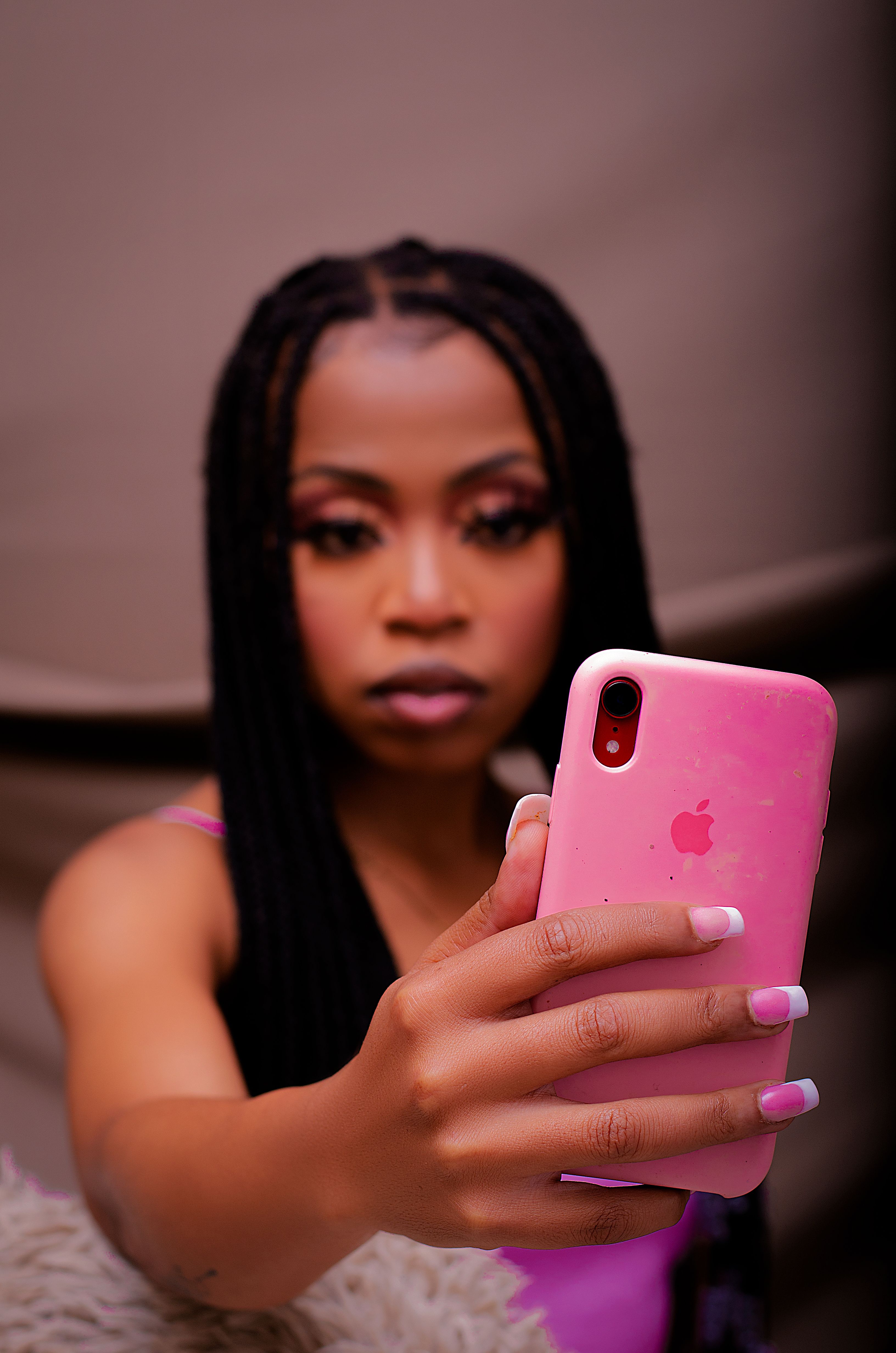 Beautiful Woman Holding a Iphone · Free Stock Photo
