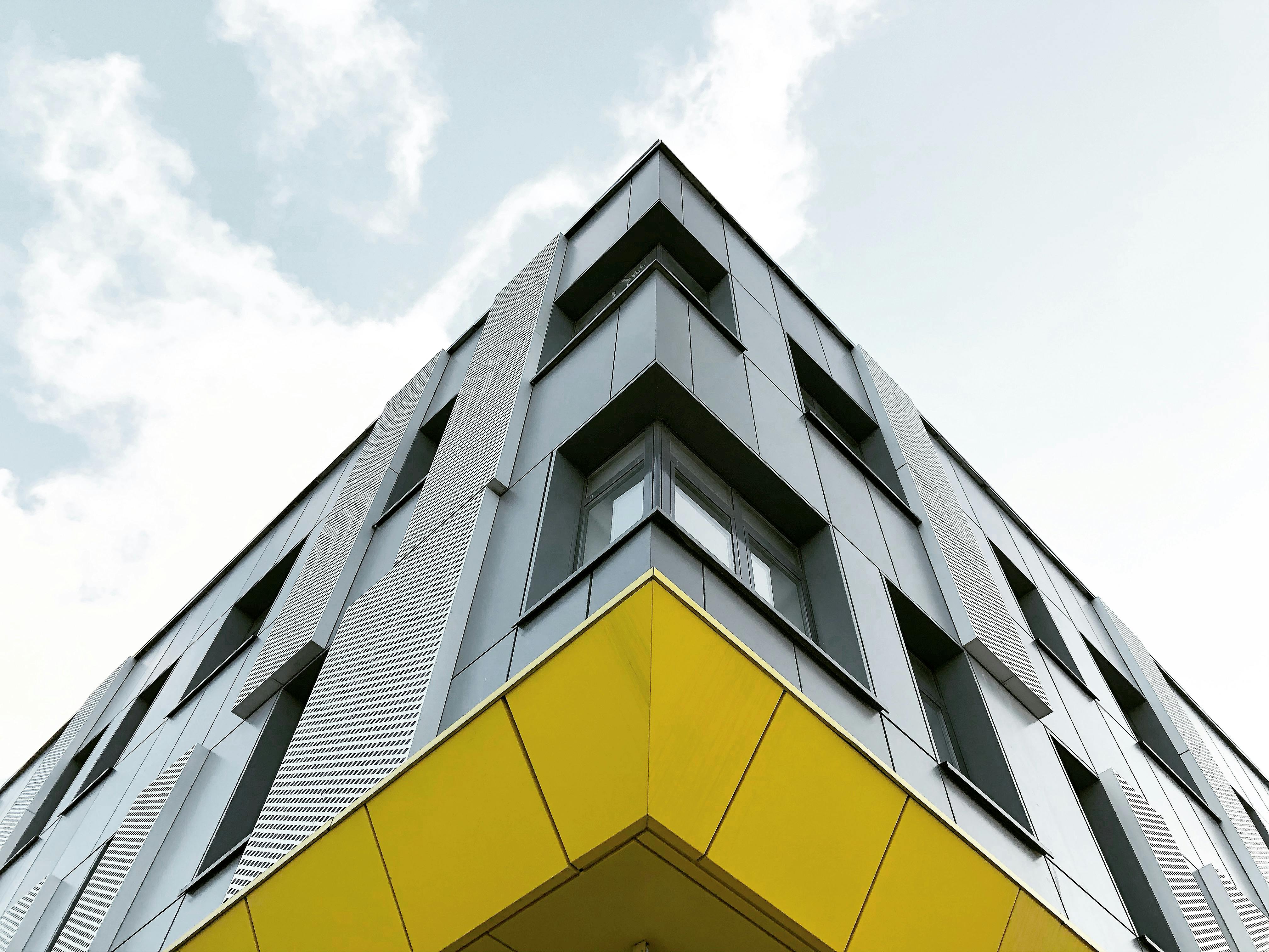Yellow and Gray Concrete Building · Free Stock Photo